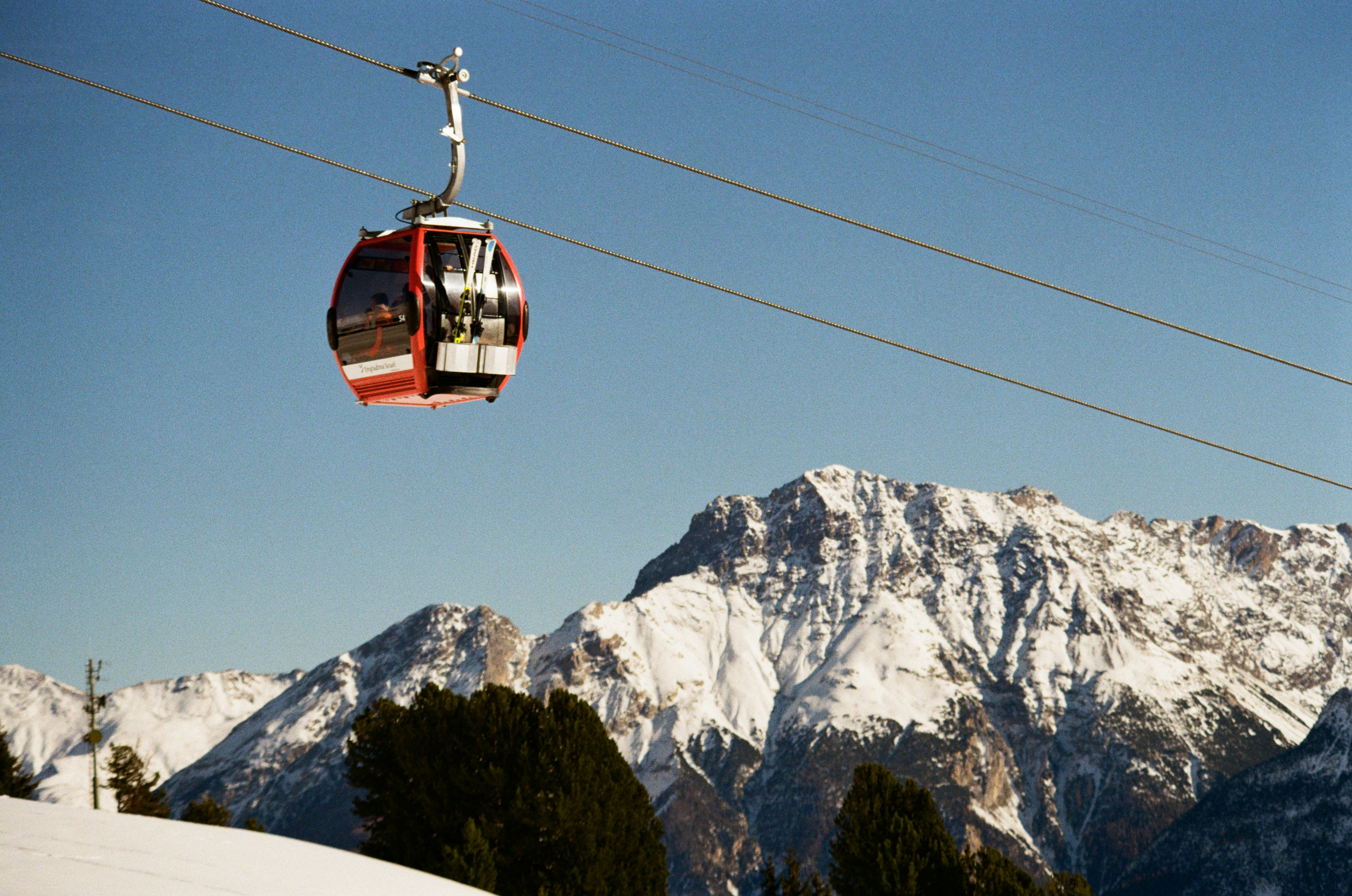 A ski lift going up the side of a mountain photo – Free Scuol Image on ...