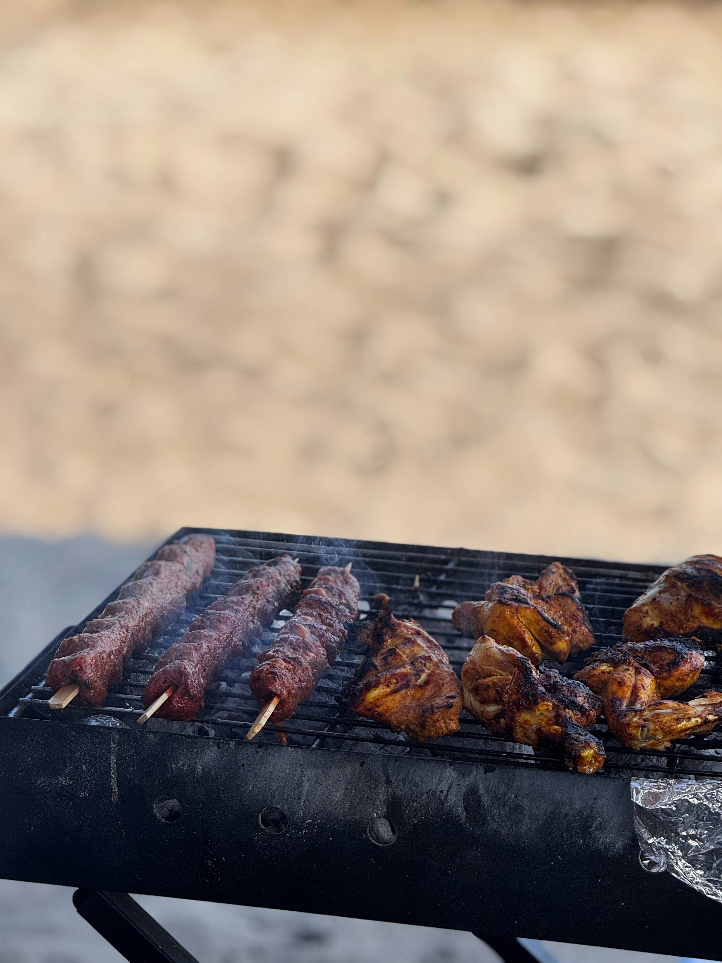A person is cooking food on a grill