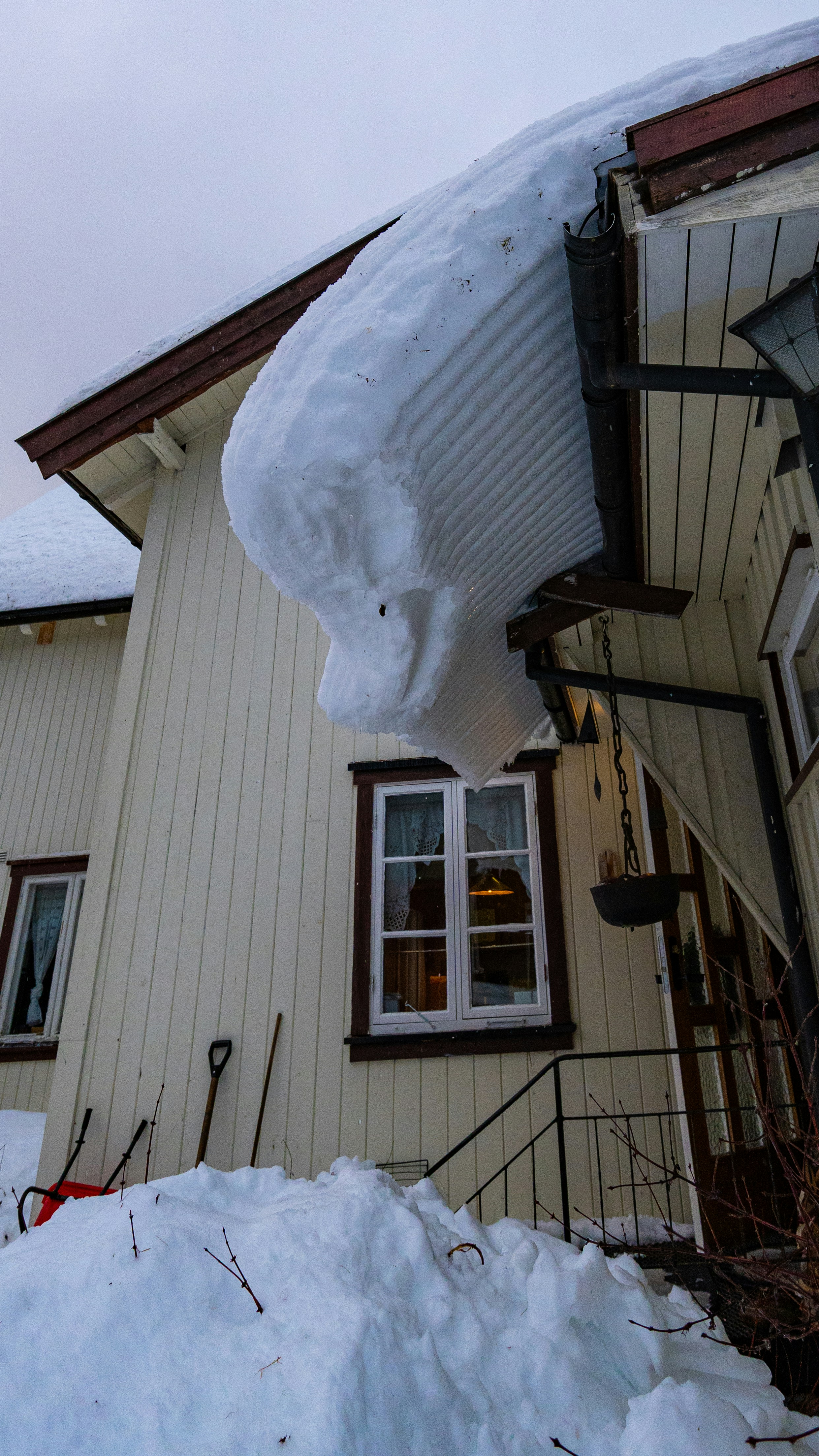 Ice Mantle Drapes a Nordic Cottage