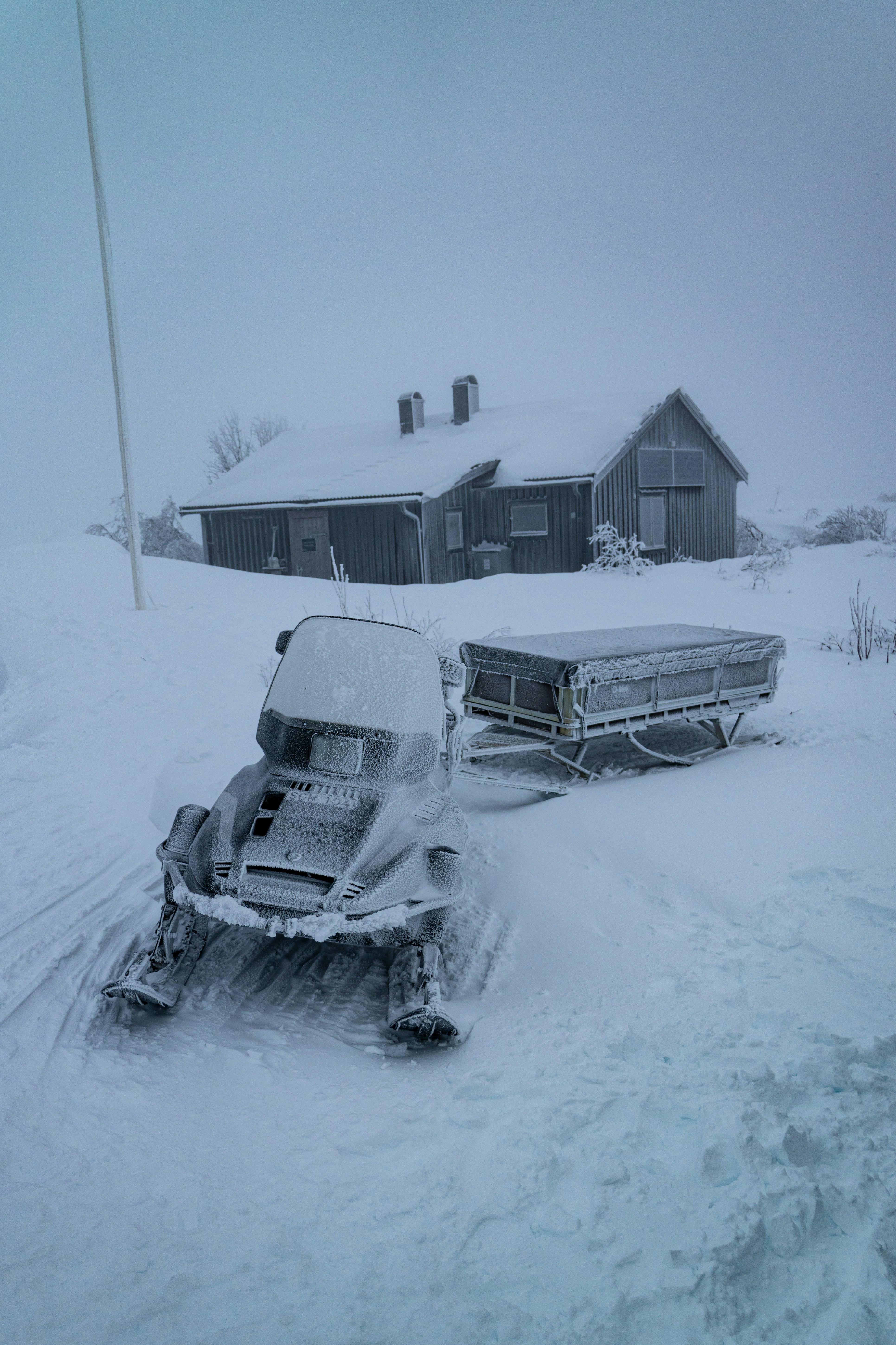 Silent Winter Retreat: The Abandoned Snowmobile