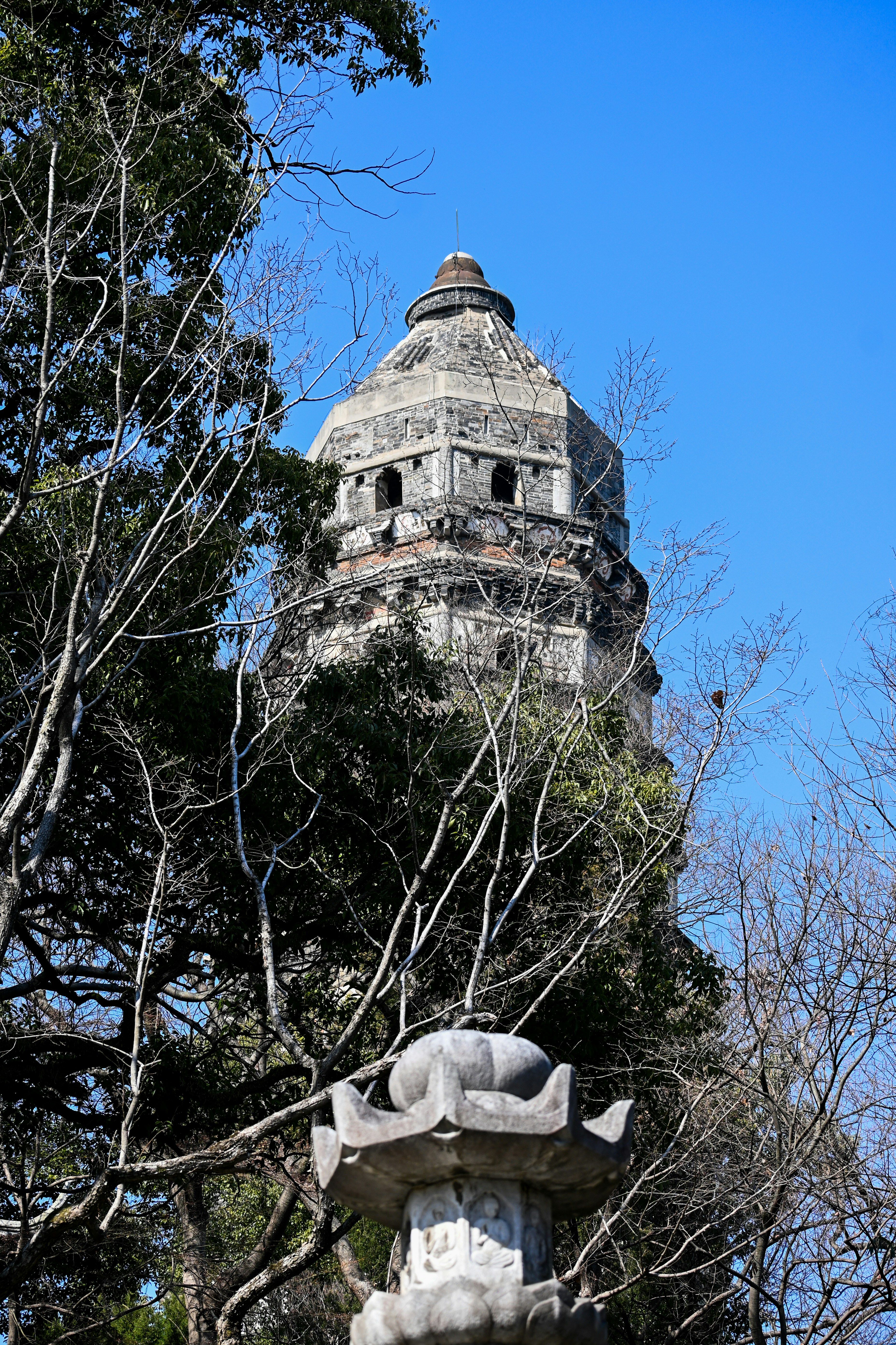 Stone Tower Pierces the Winter Thicket Under a Cobalt Sky