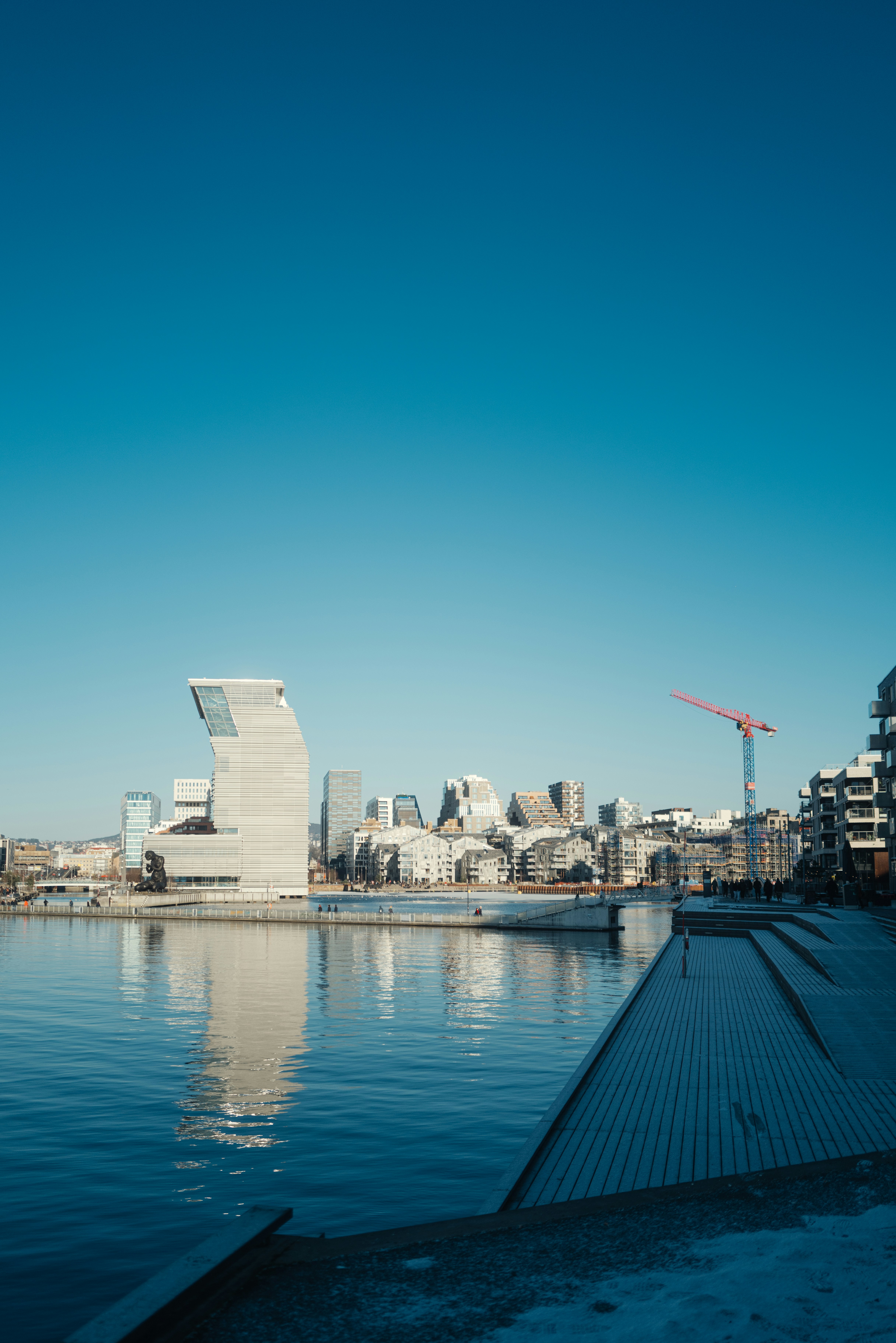 A large body of water with a city in the background