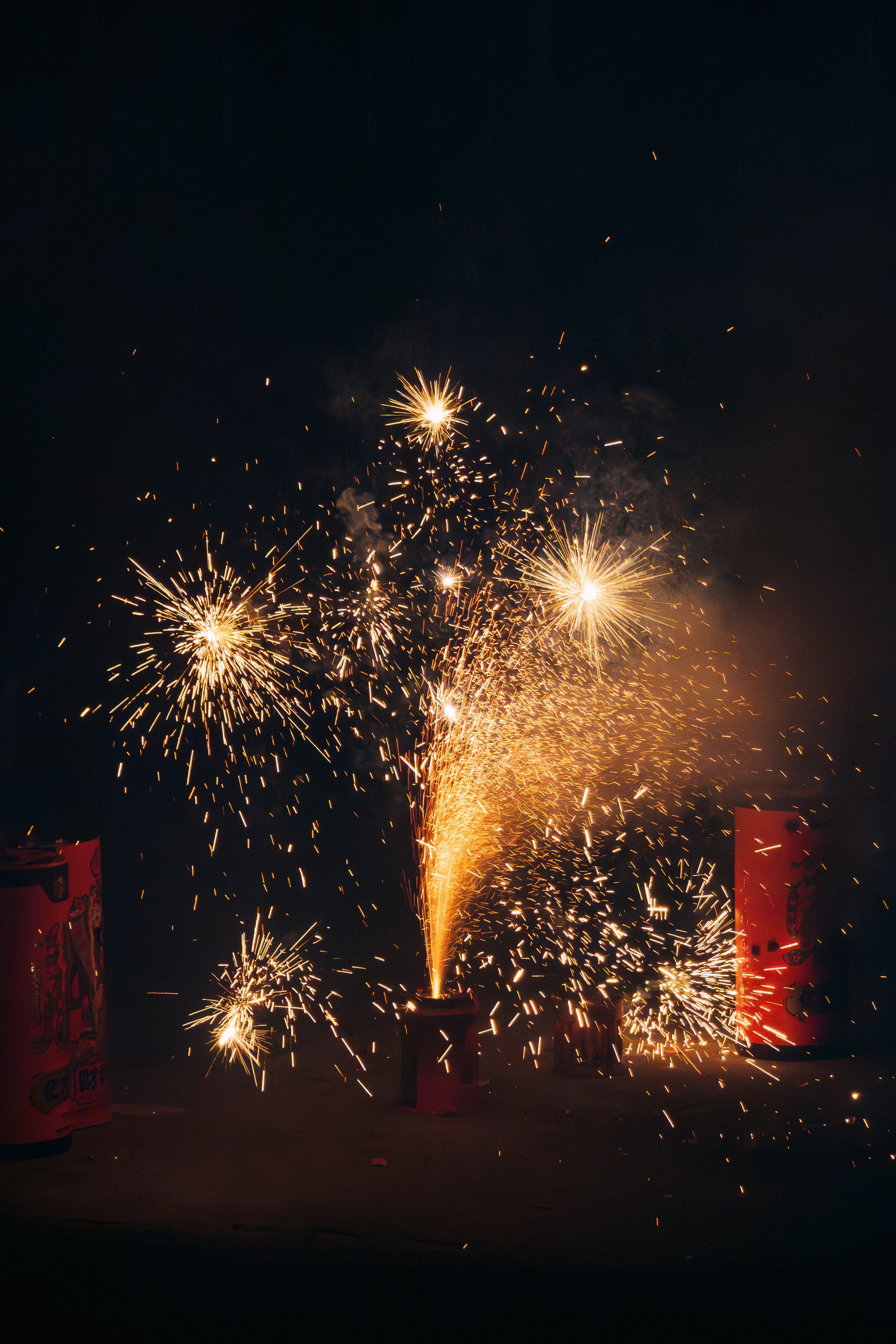A bunch of fireworks are lit up in the night sky