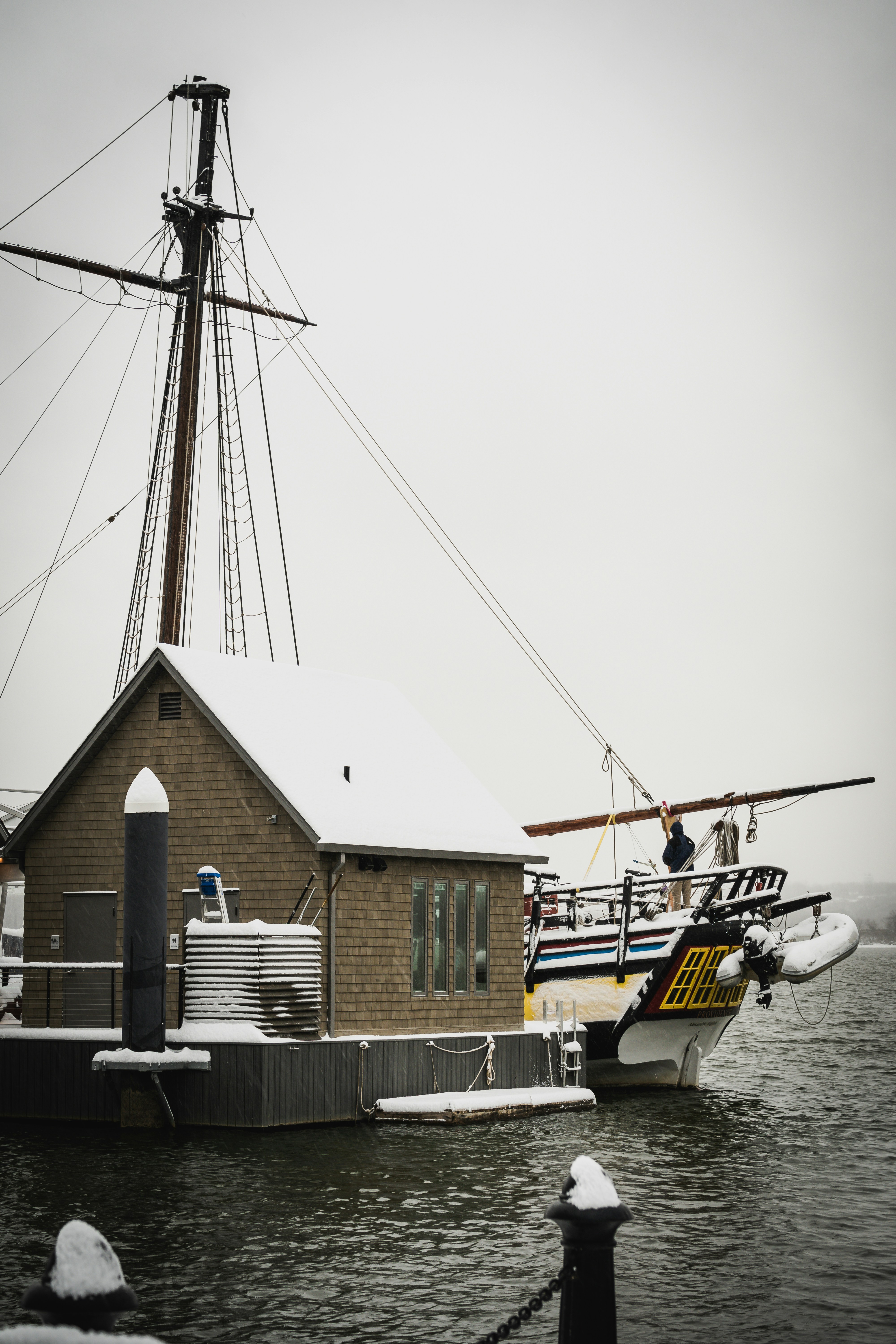 Mast Lines over a Snowbound Harbor House