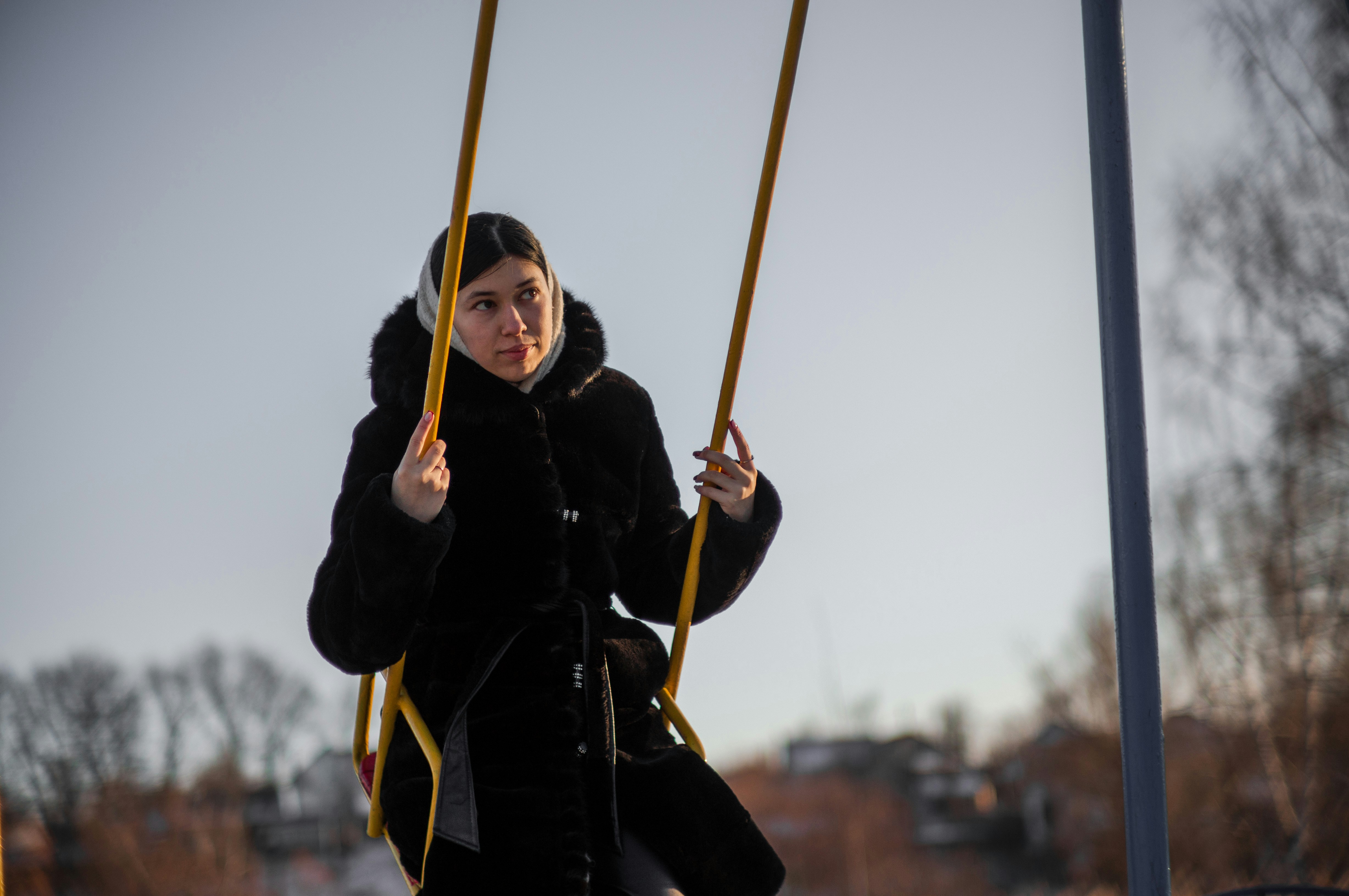 Winter's Quiet Reflection on a Swing