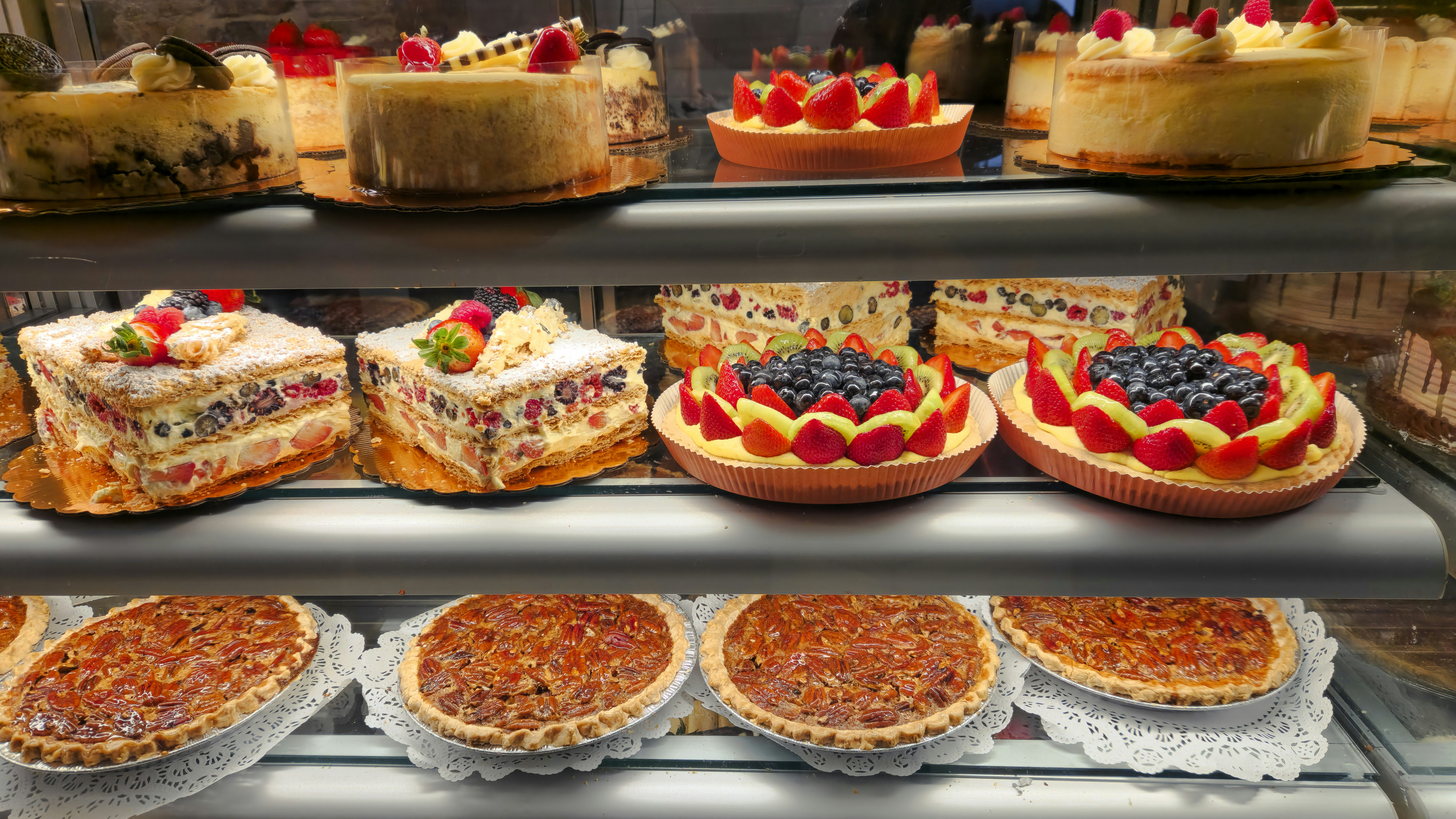 Photos from a cake store in Brooklyn where I ate no cake cause none of it was eggless :( | A display case filled with lots of different types of pies