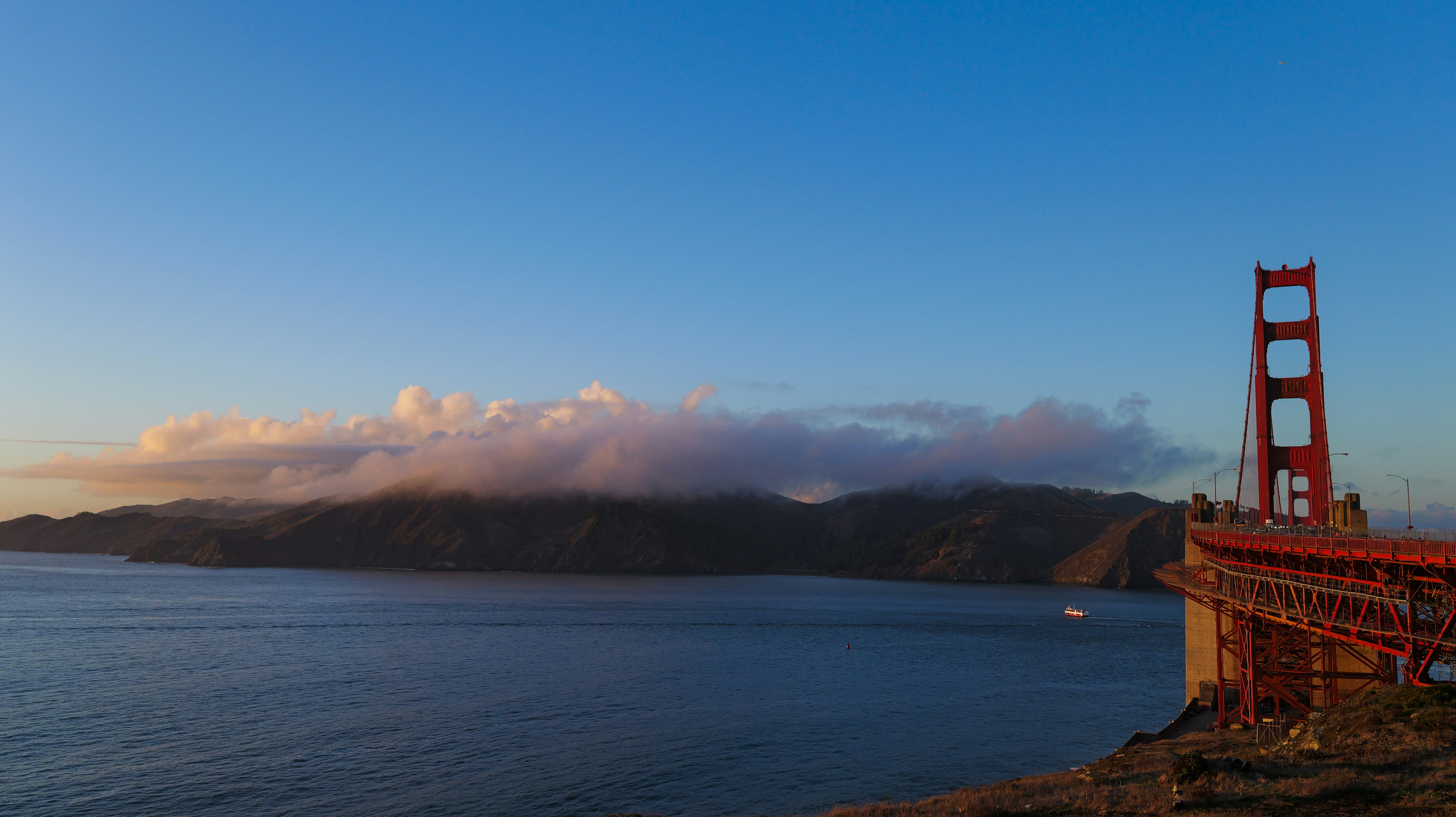 Dusk Over the Bay: The Golden Gate Bridge Embraced by Ember Light