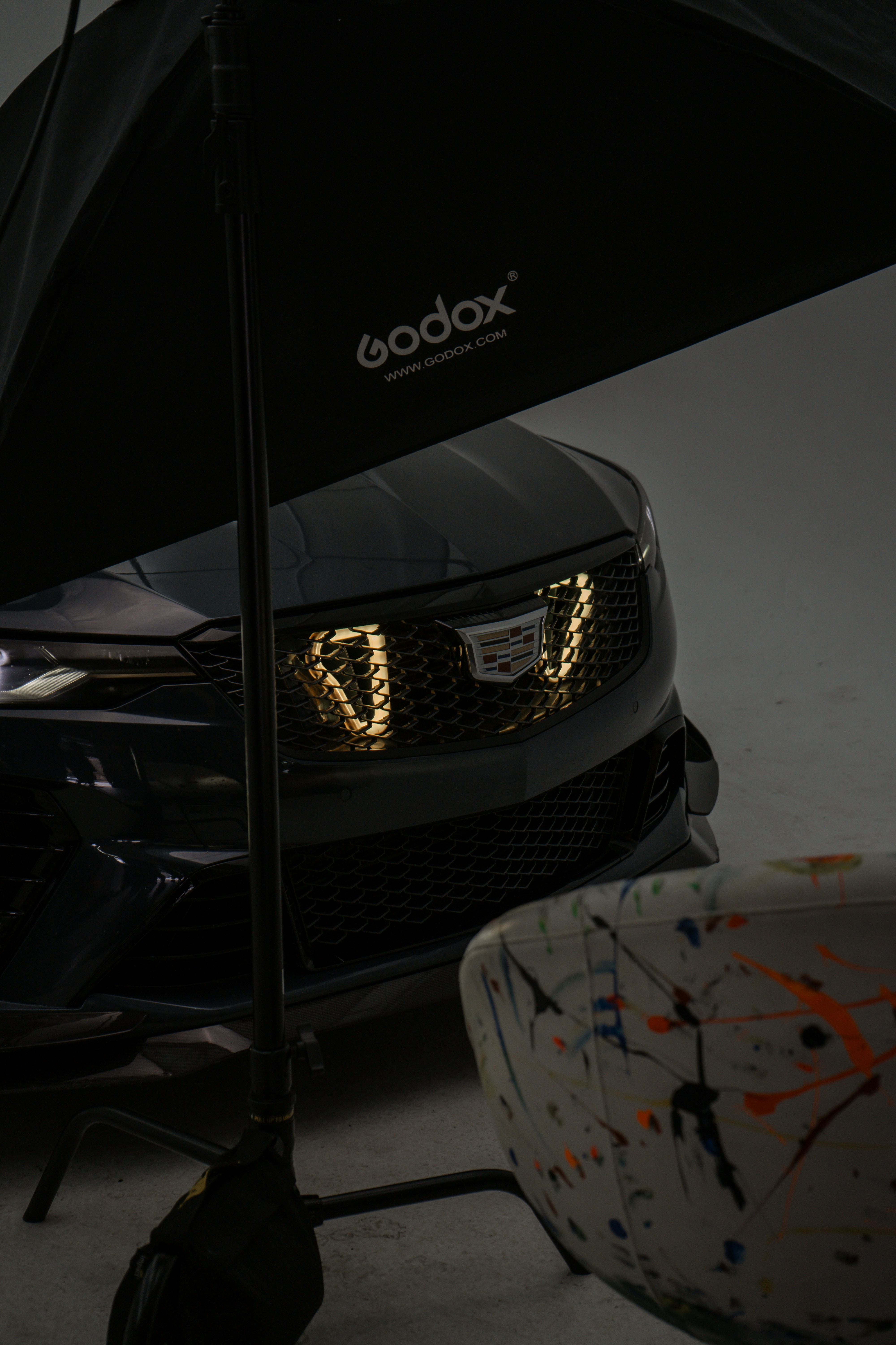 Midnight Cadillac Under Studio Glow: Front Grille in Focus