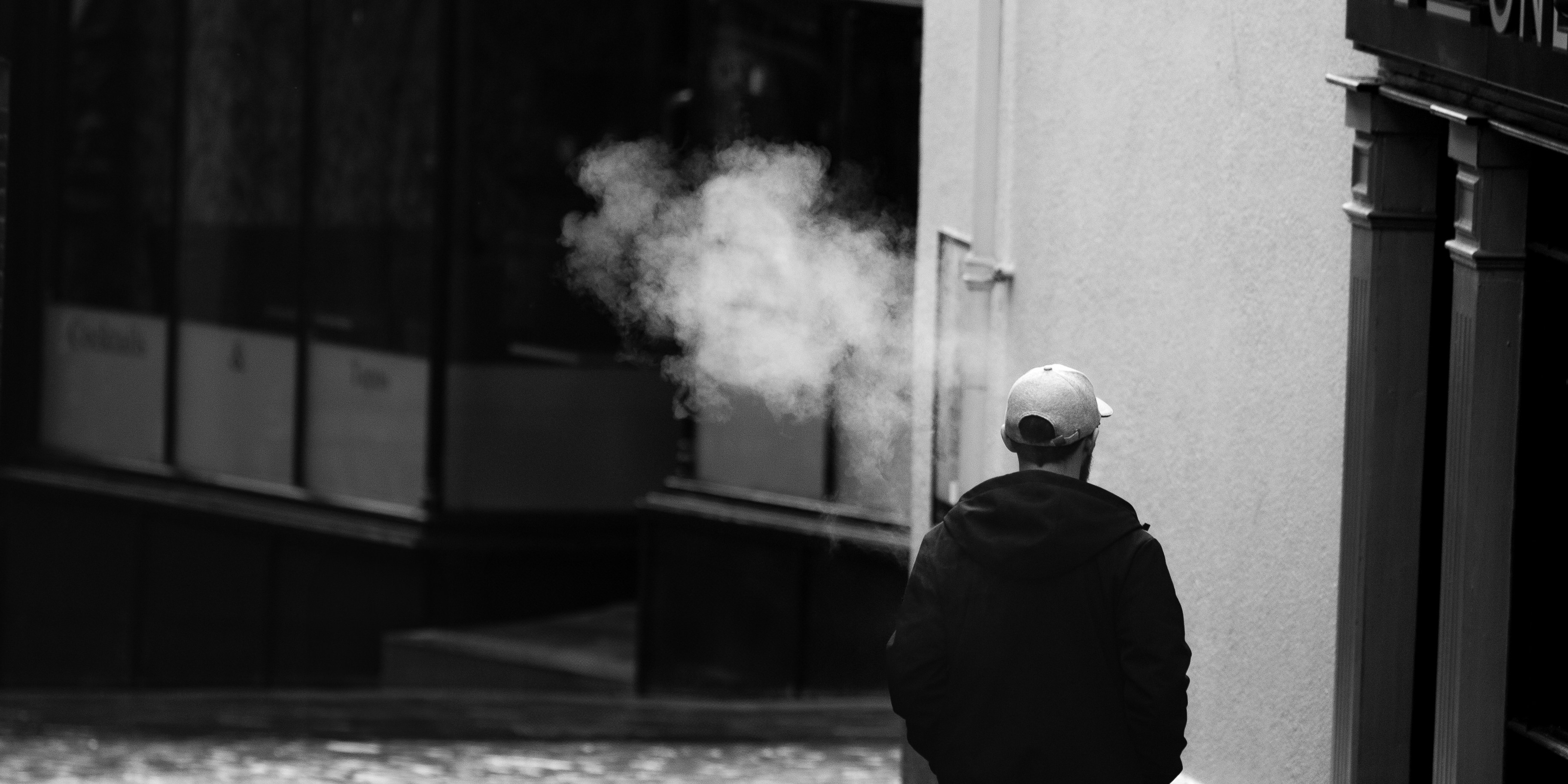 Back-turned in Cold Light: A Quiet Black-and-White Street Moment