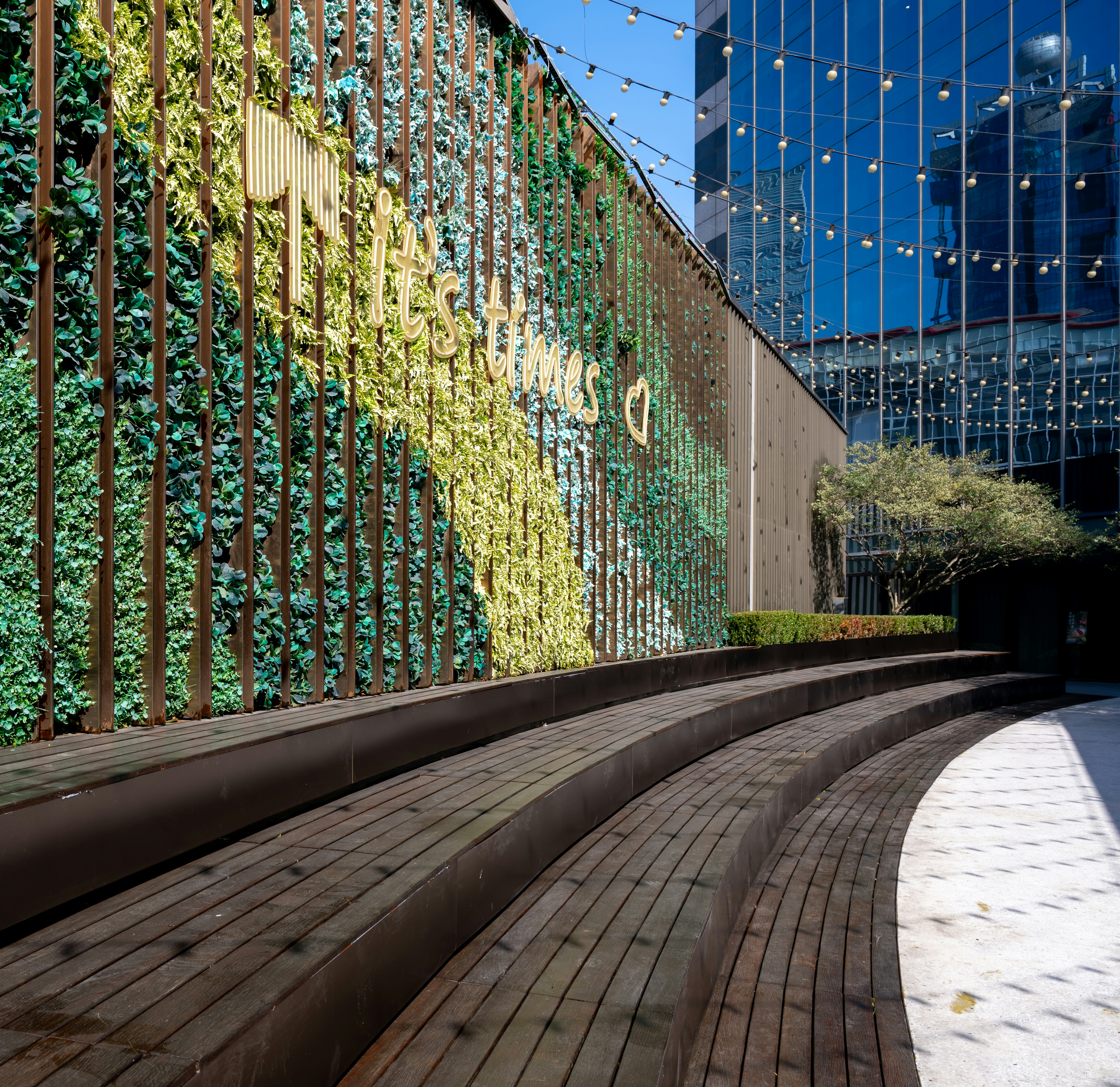 A wooden bench sitting next to a tall building photo – Free Pudong ...
