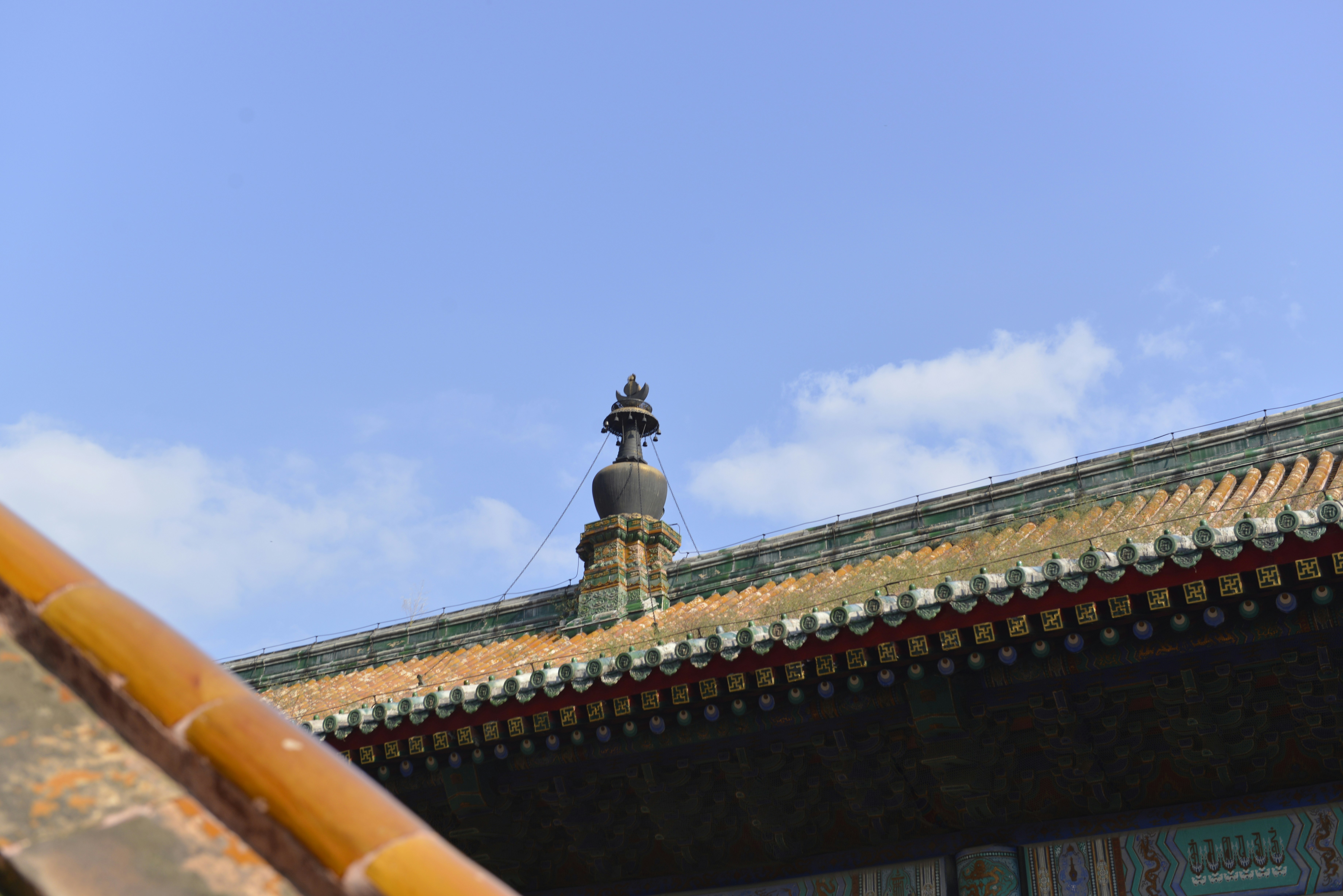 Temple Roofline Against Sky with Decorative Finial