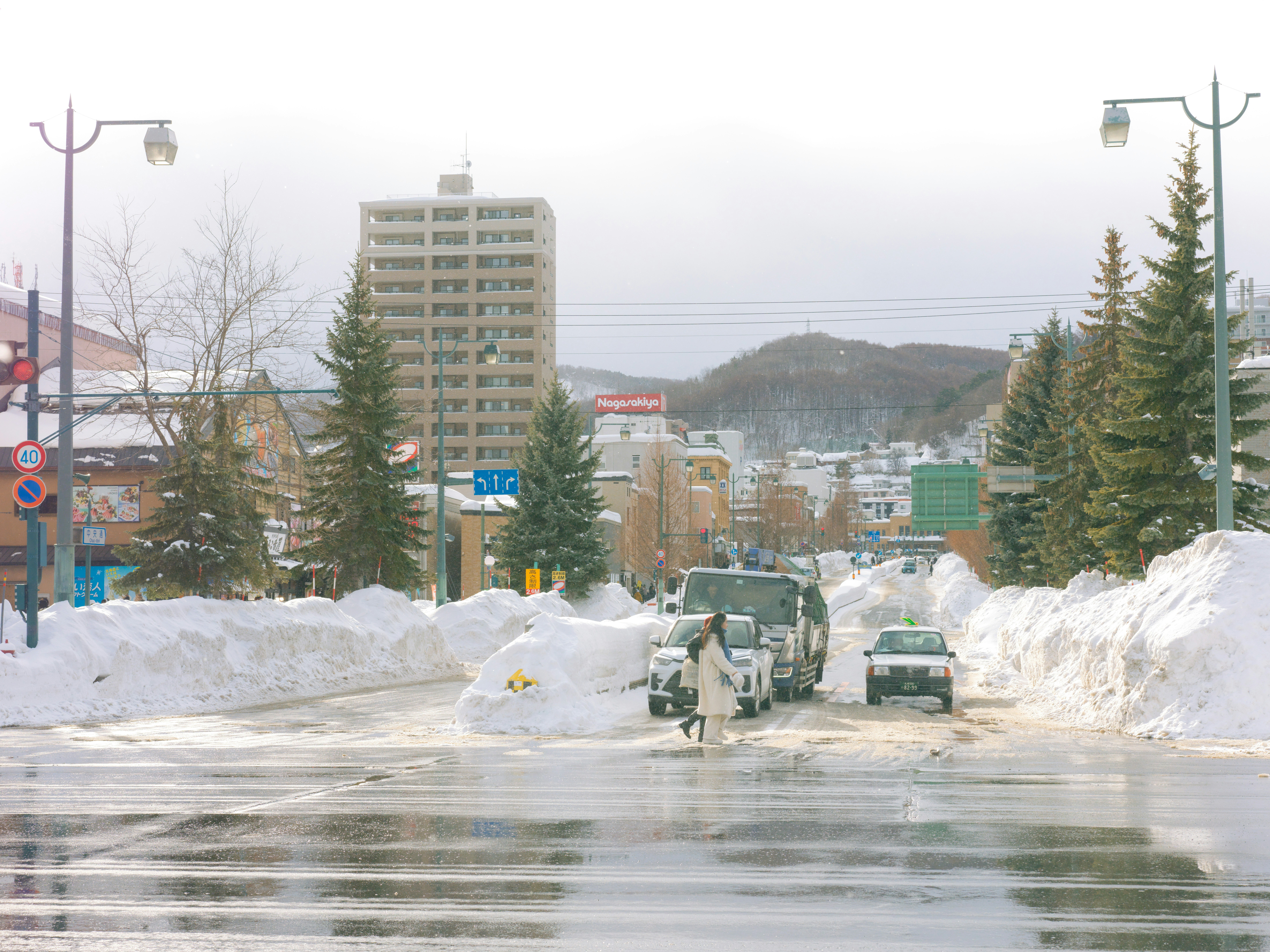 Snow-Glazed Main Street: A Quiet City Crossing Framed by Snowbanks