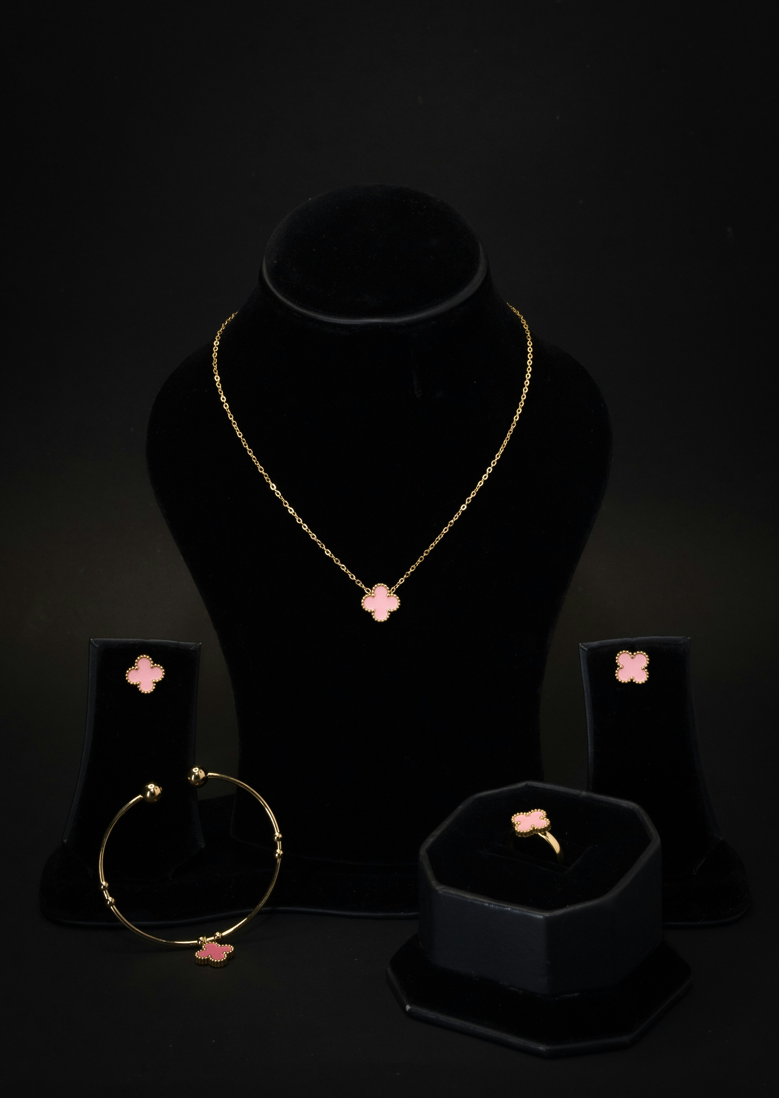 Pink Clover Pendant Ensemble: A Velvet Jewelry Display