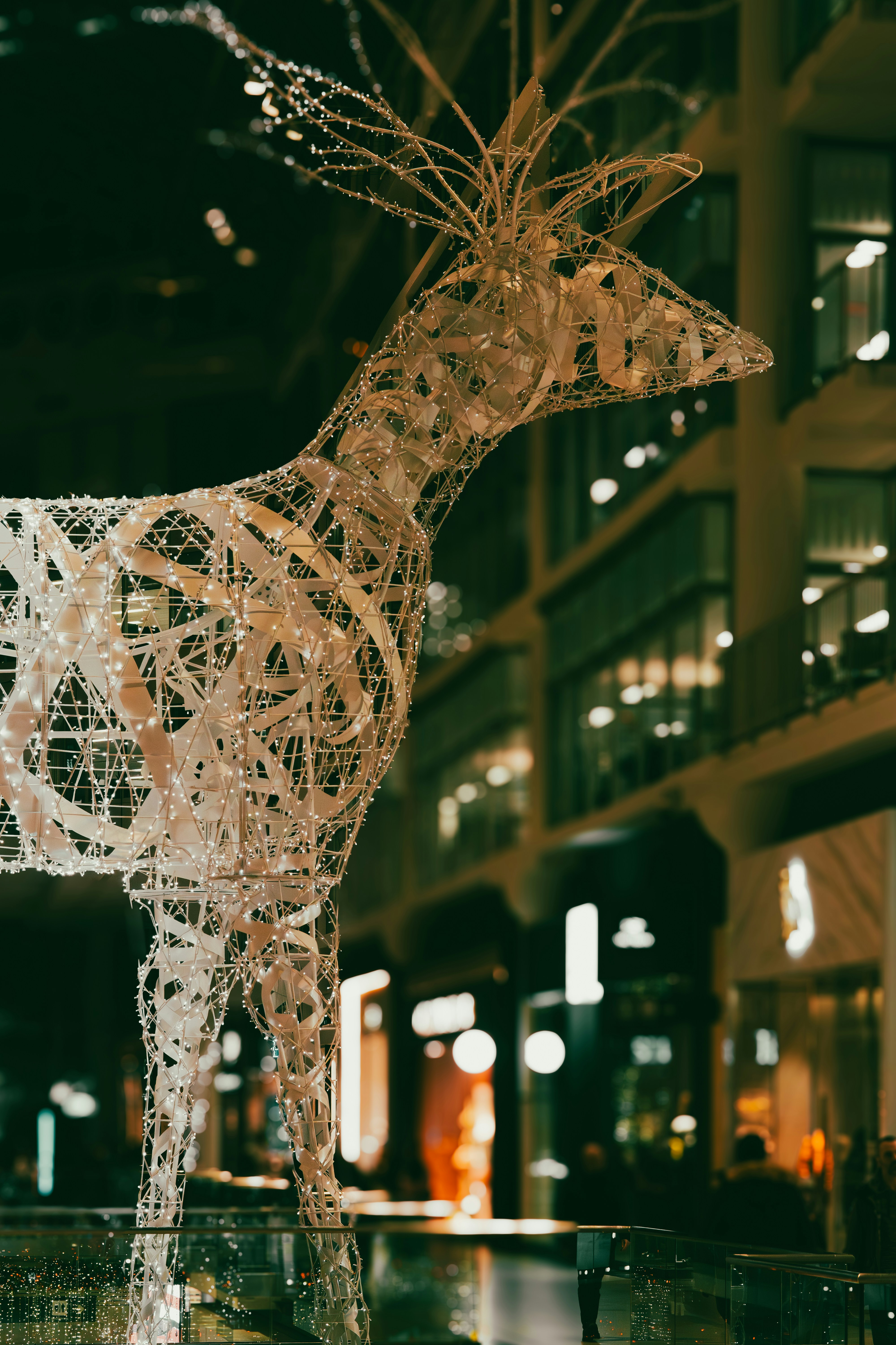 Glowing Reindeer in Urban Nightscape