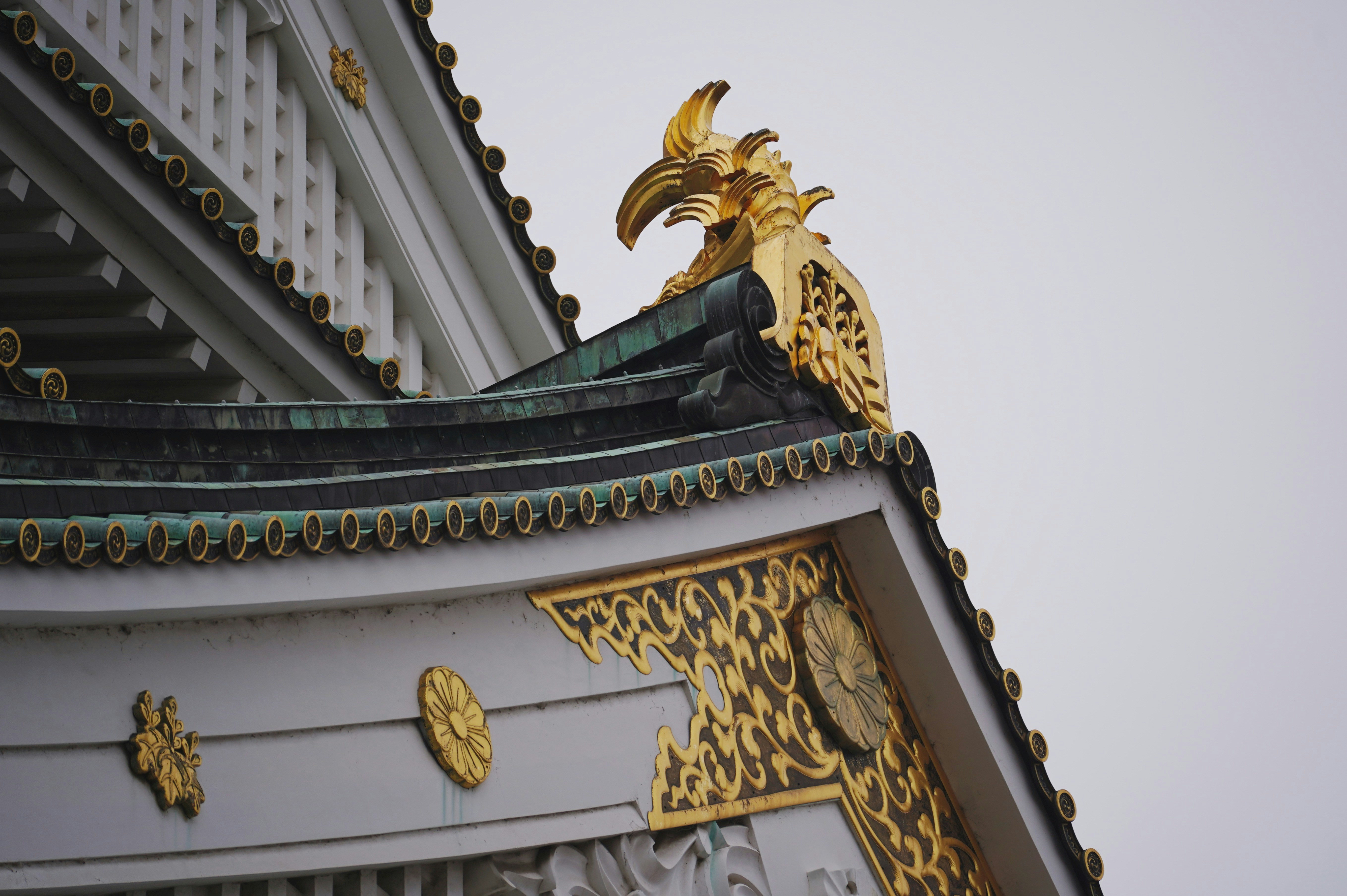 Gilded Dragon Crest on a Traditional Roof