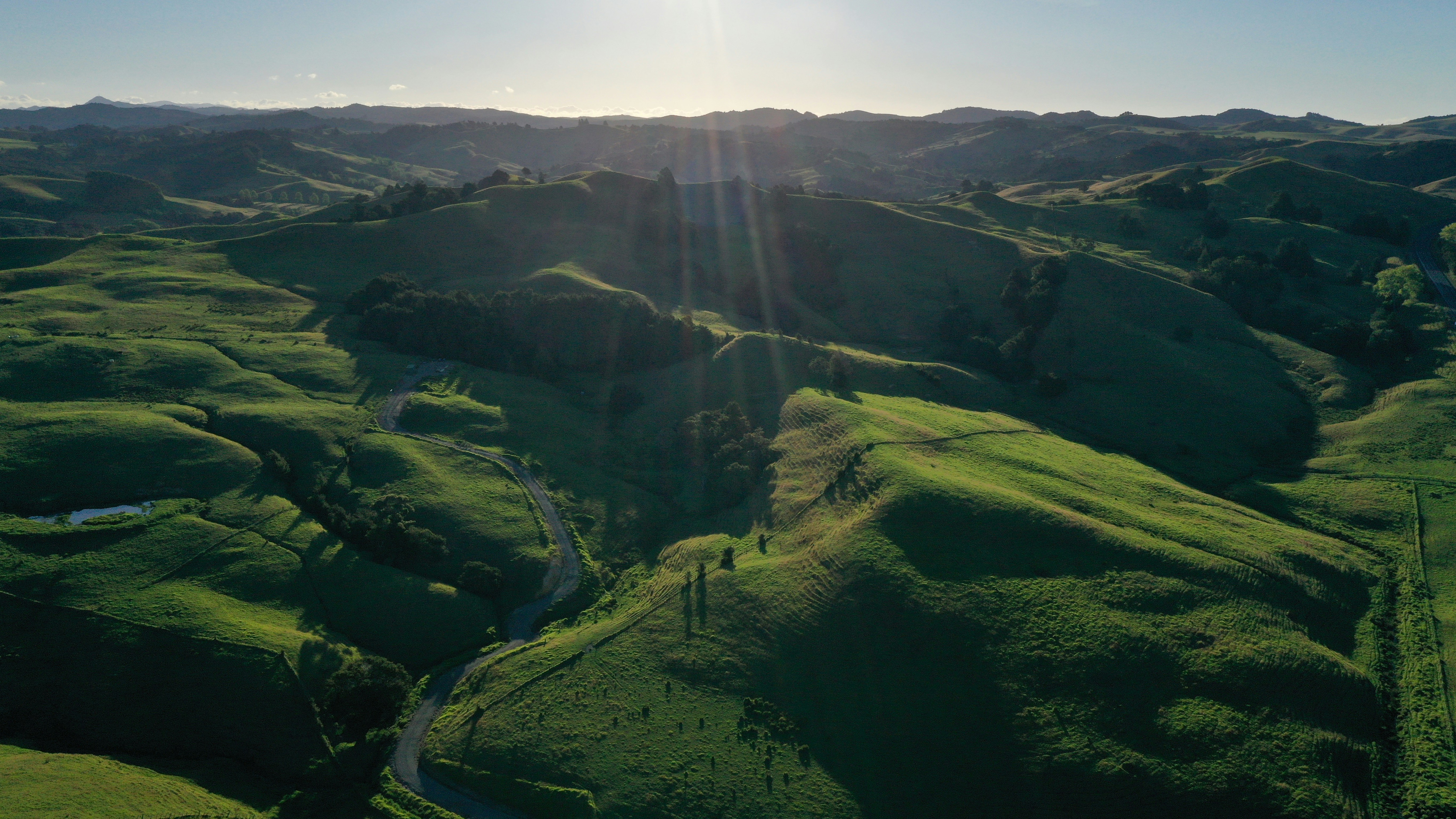 Golden Rays Over Verdant Valleys