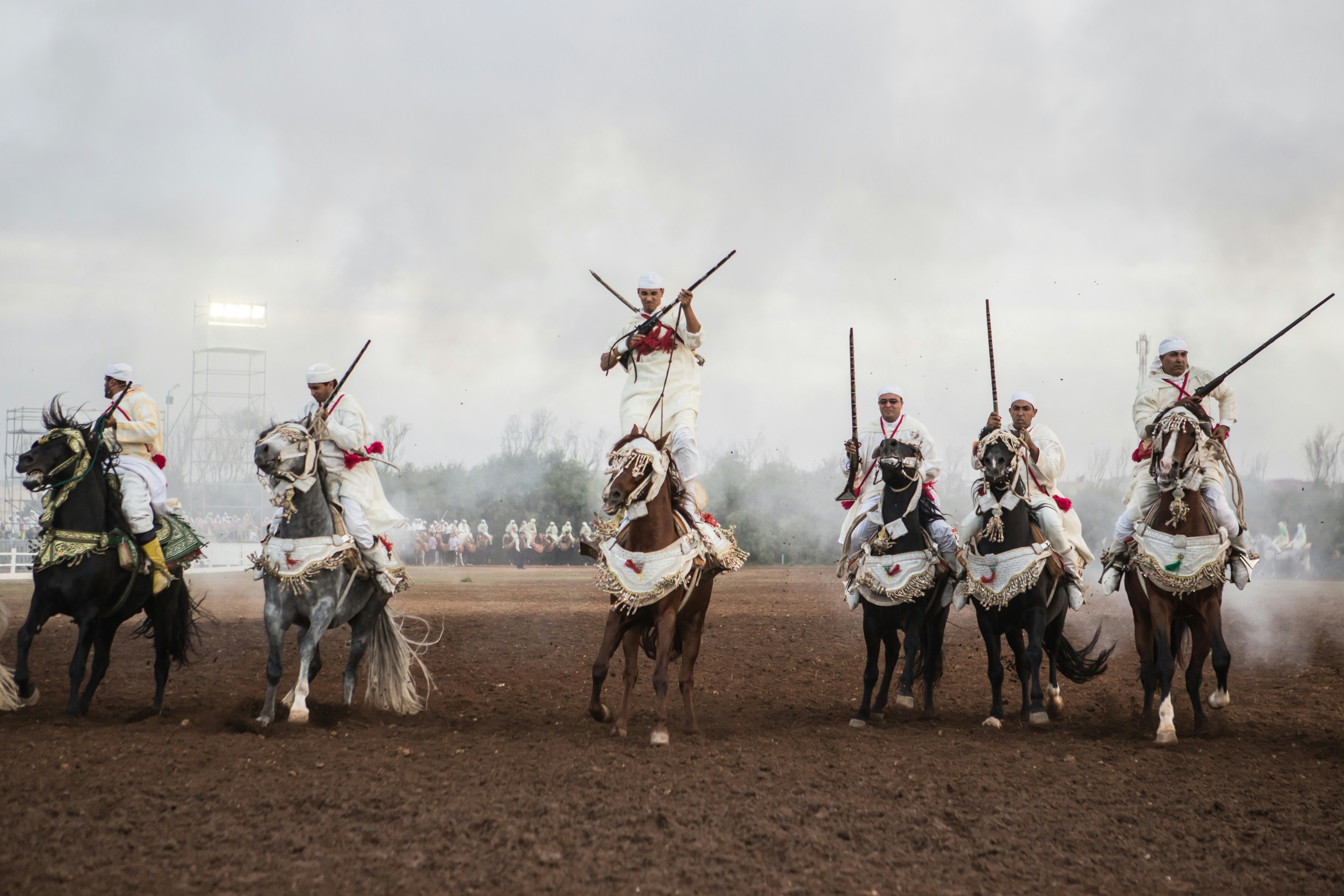 A group of men riding on the backs of horses photo – Free Man Image on ...