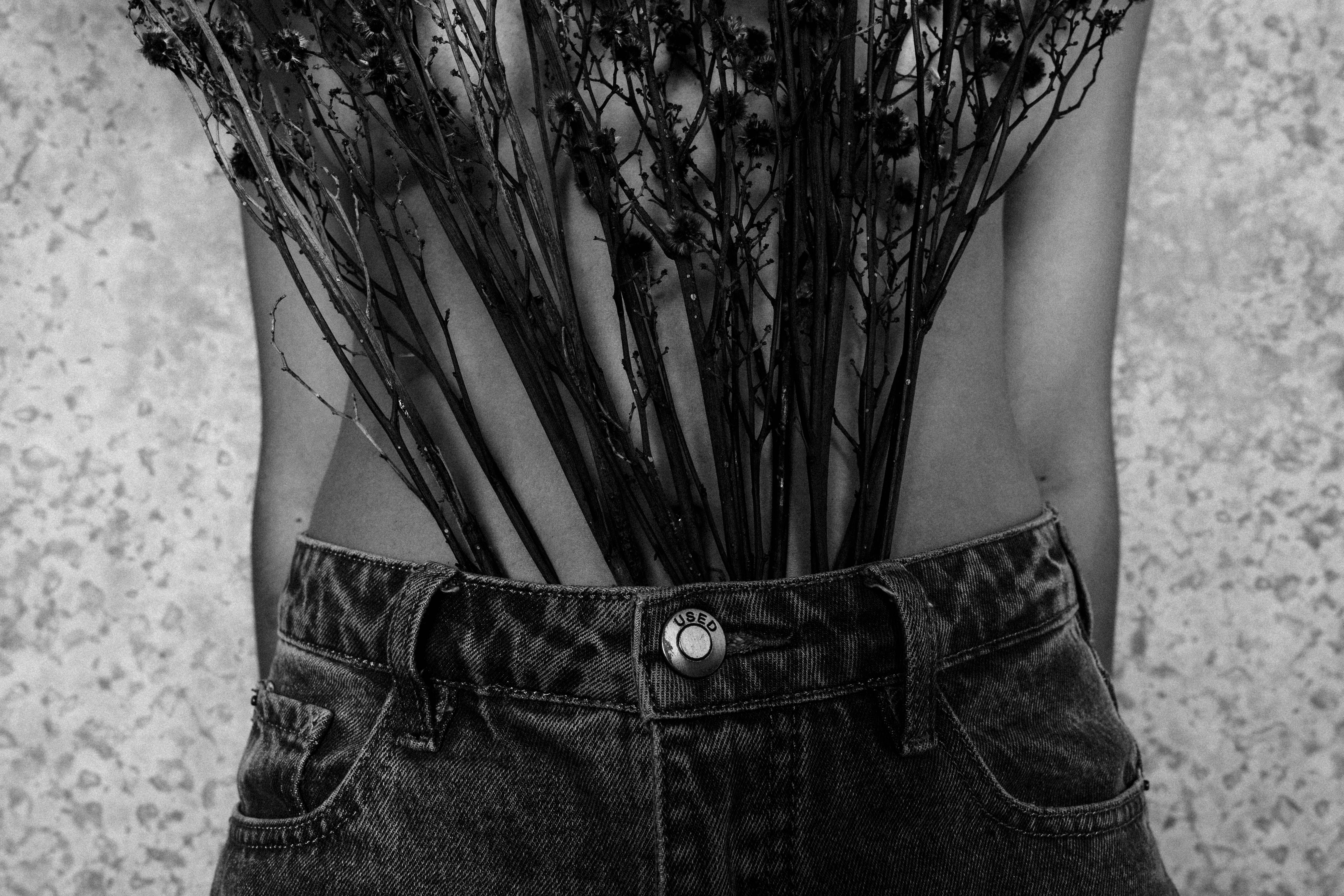 Stems Through Denim: A Monochrome Dance of Flora and Fabric