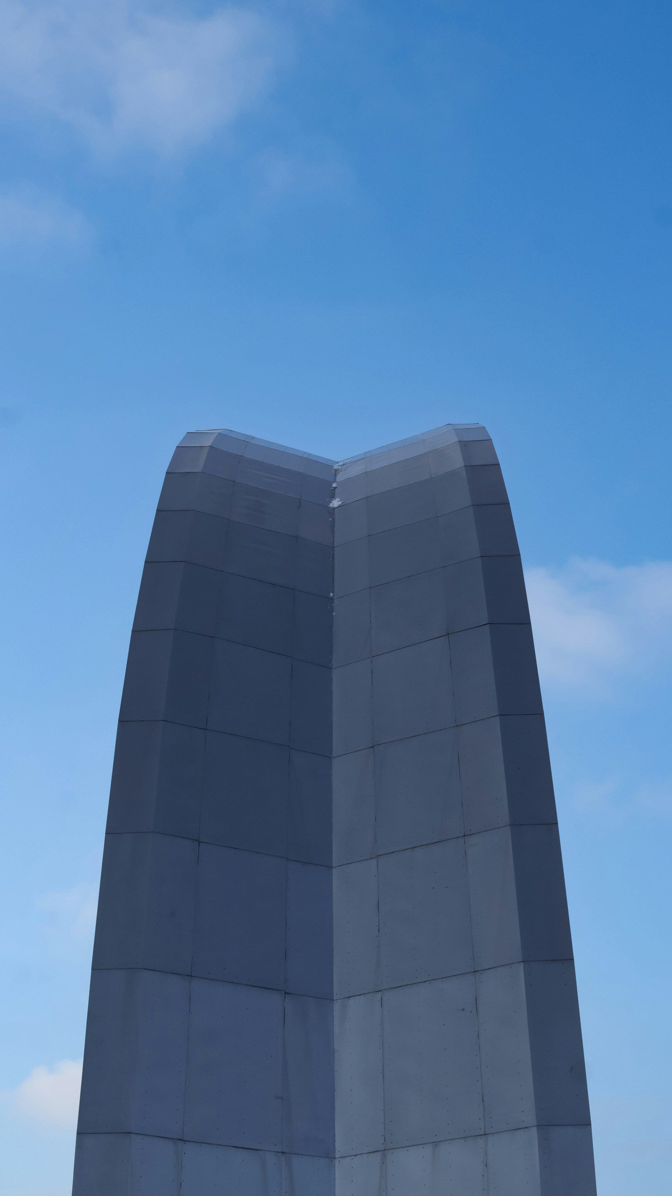 Convergence at the Crest: Twin Monoliths Rise to Meet the Sky