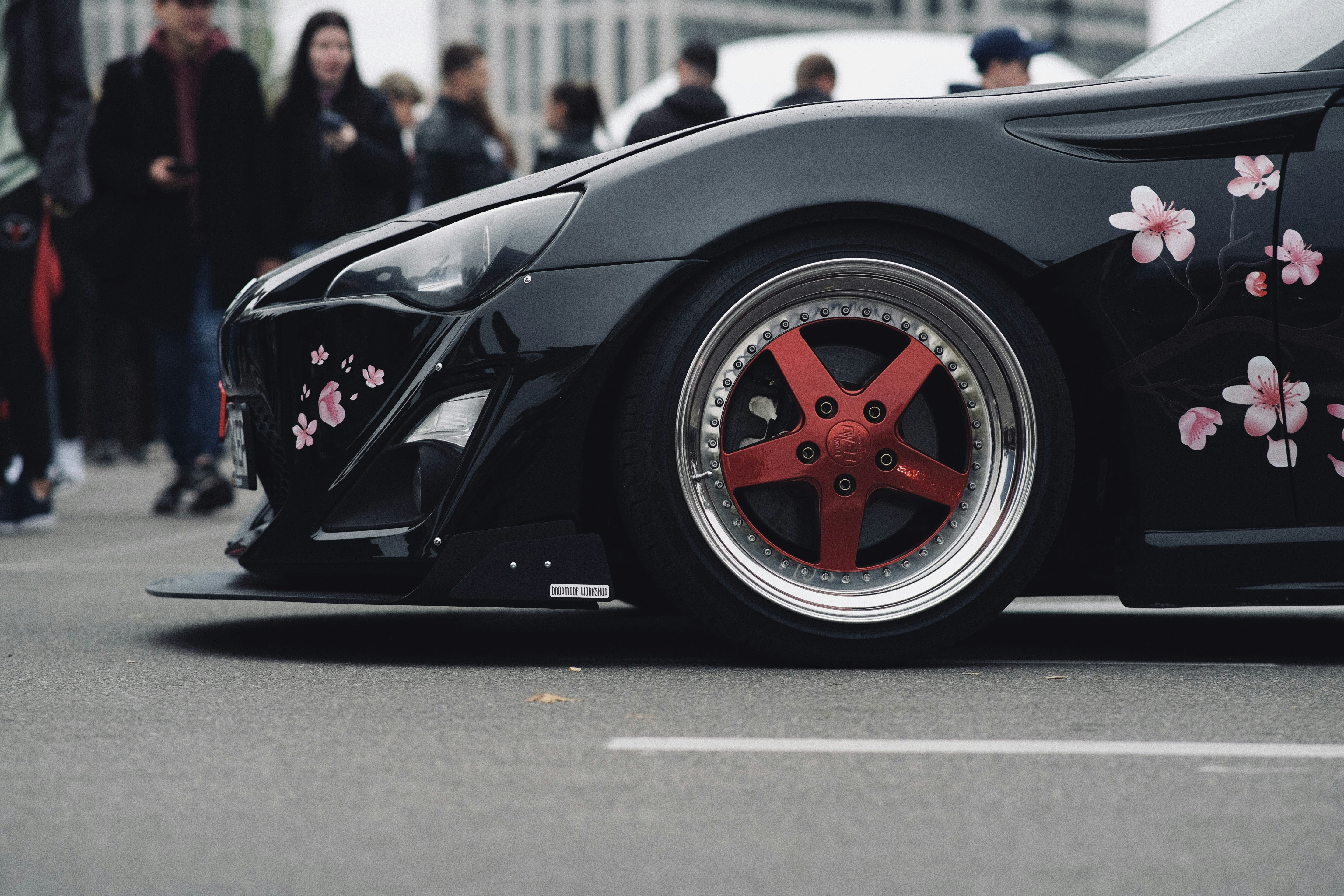 A car with flowers painted on the side of it