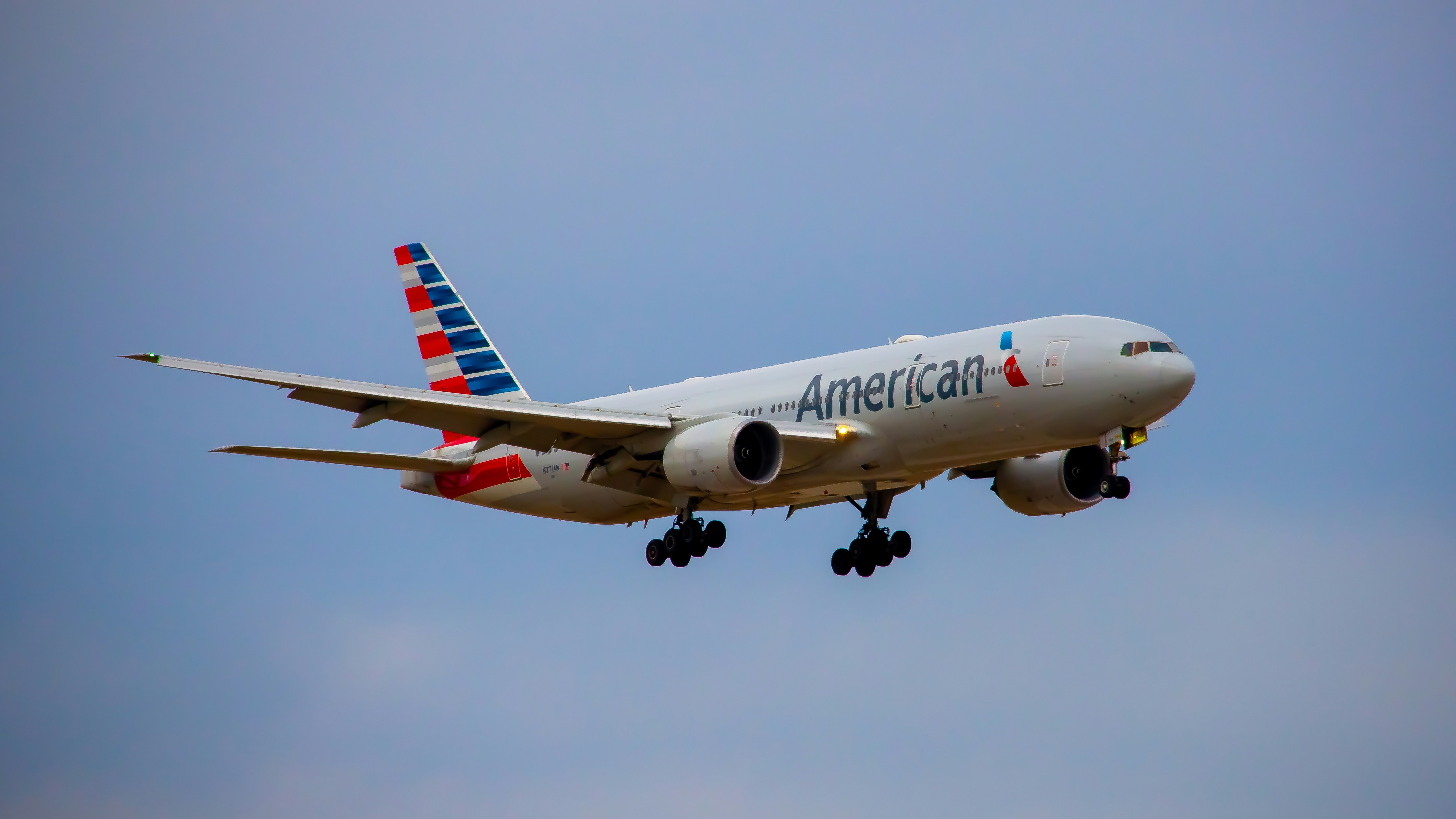 An american airlines jet flying in the sky photo – Free Wallpaper 4k ...
