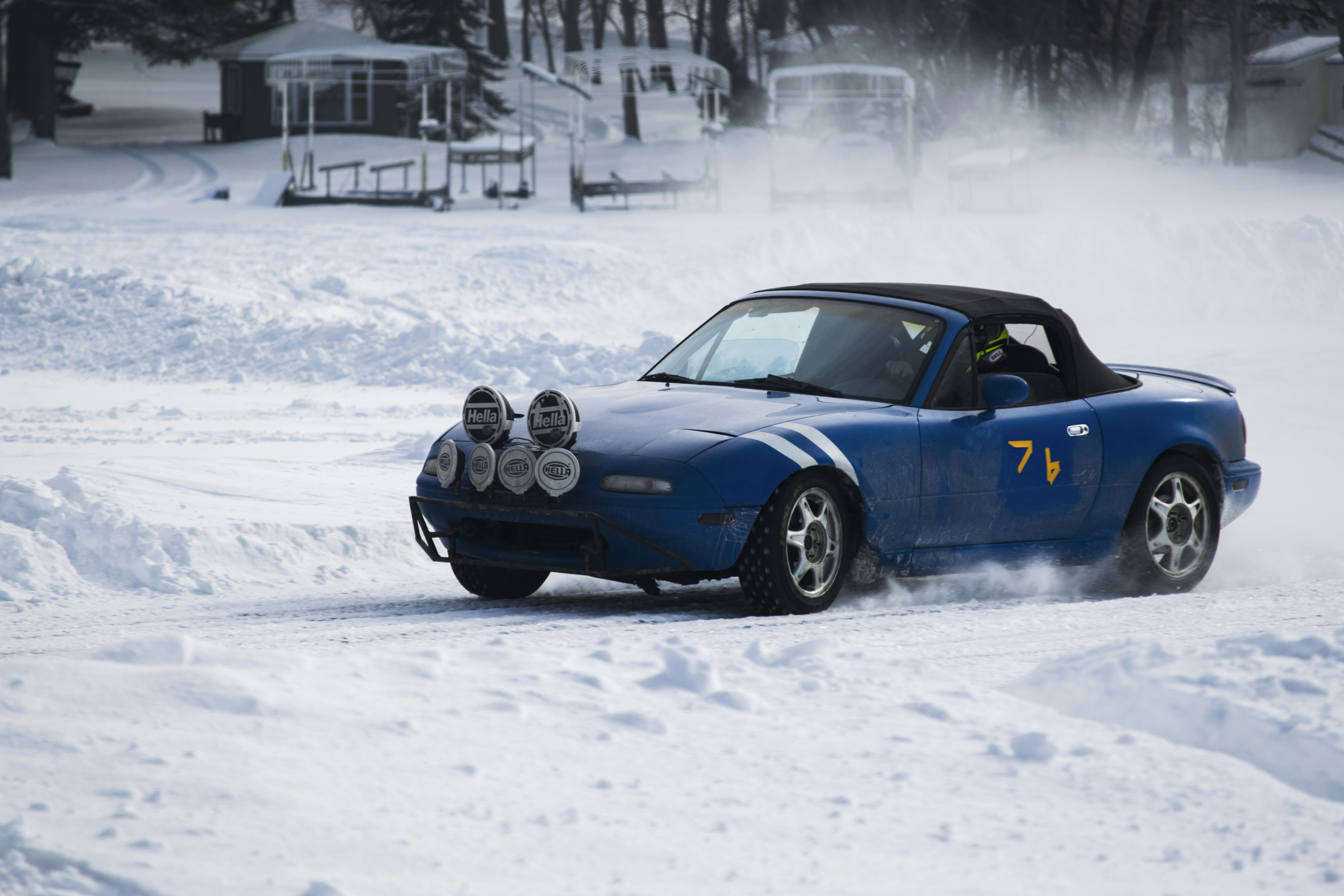 Snowbound Sprint: Blue Miata Rips Through Frosty Snow Track