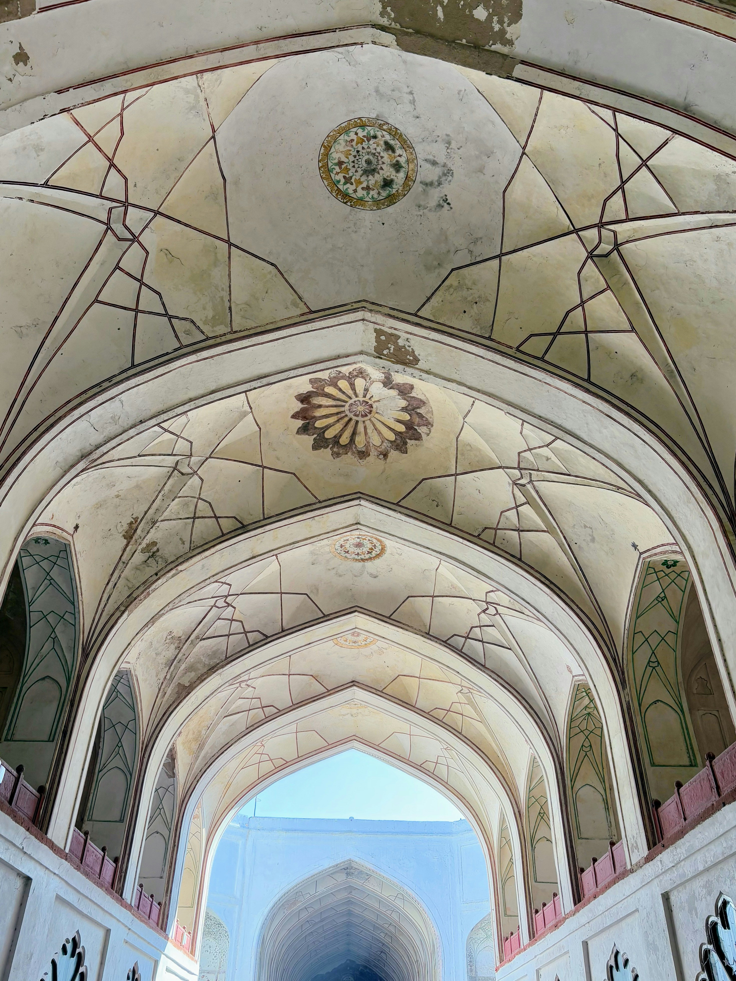 Rosette Vaults: Echoes of Light Through a Sunlit Arch Corridor
