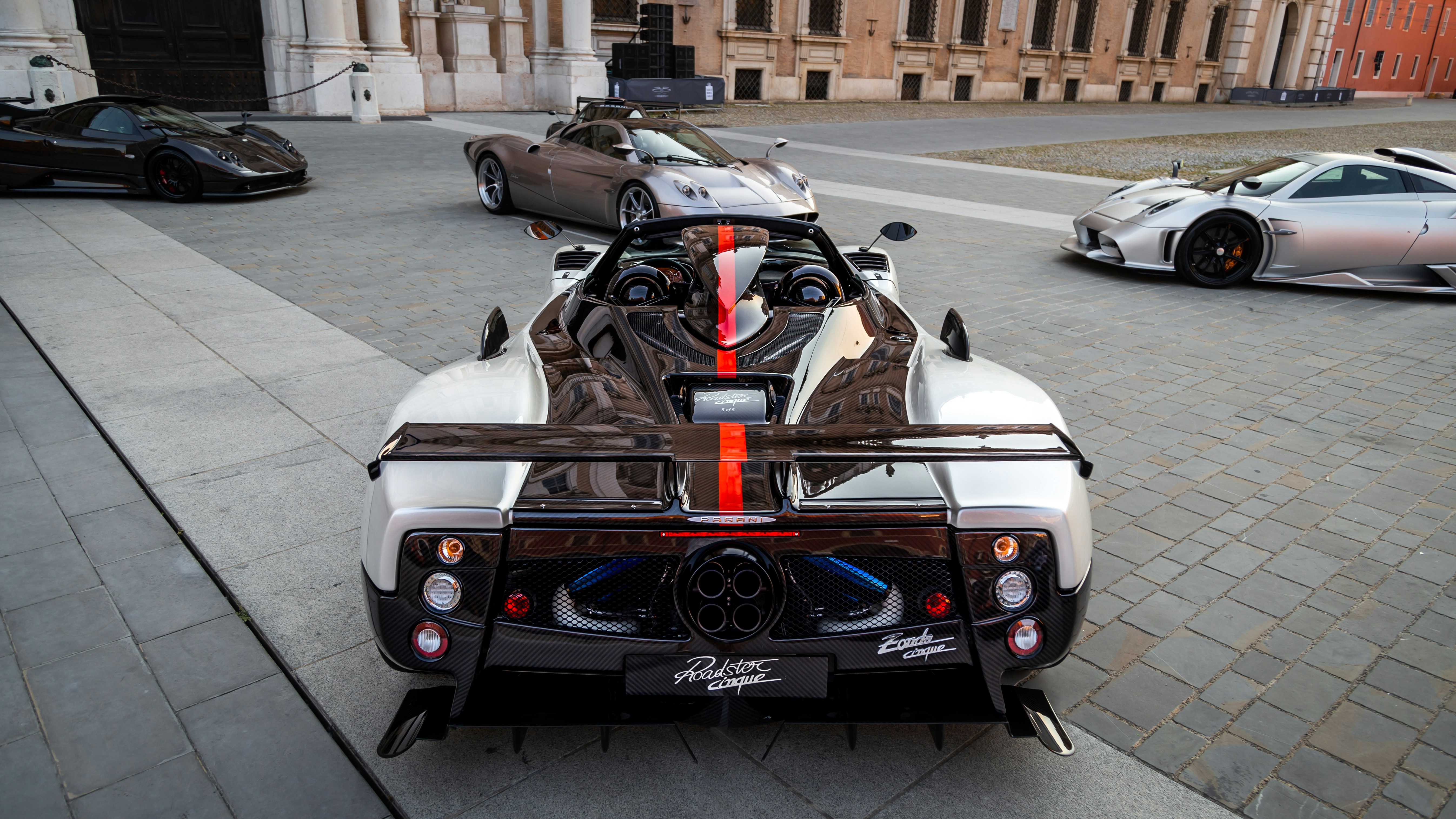 A group of cars parked on the side of a road photo – Free Supercar ...