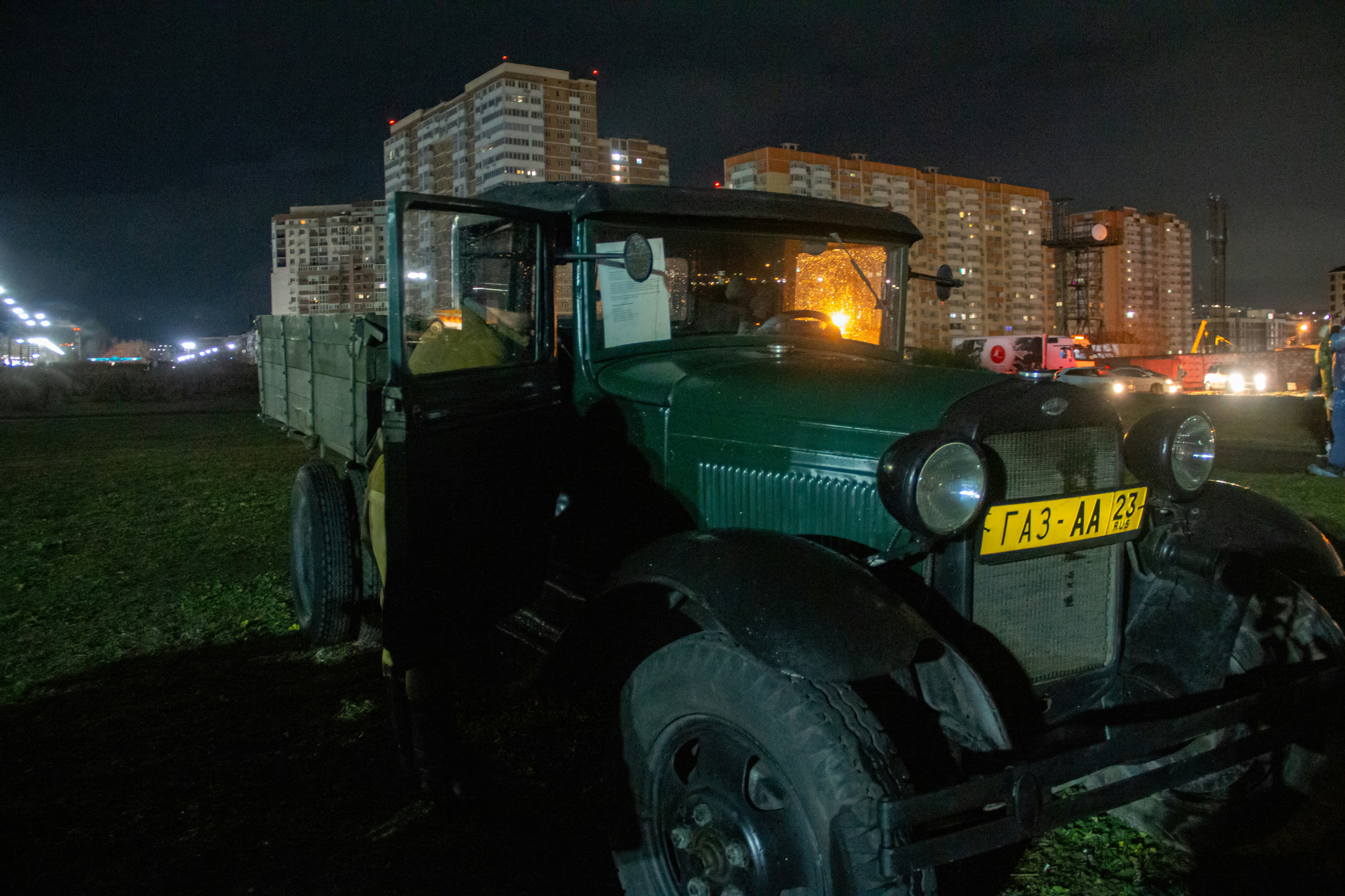 Timeworn Legacy: A Vintage Truck Under Urban Lights