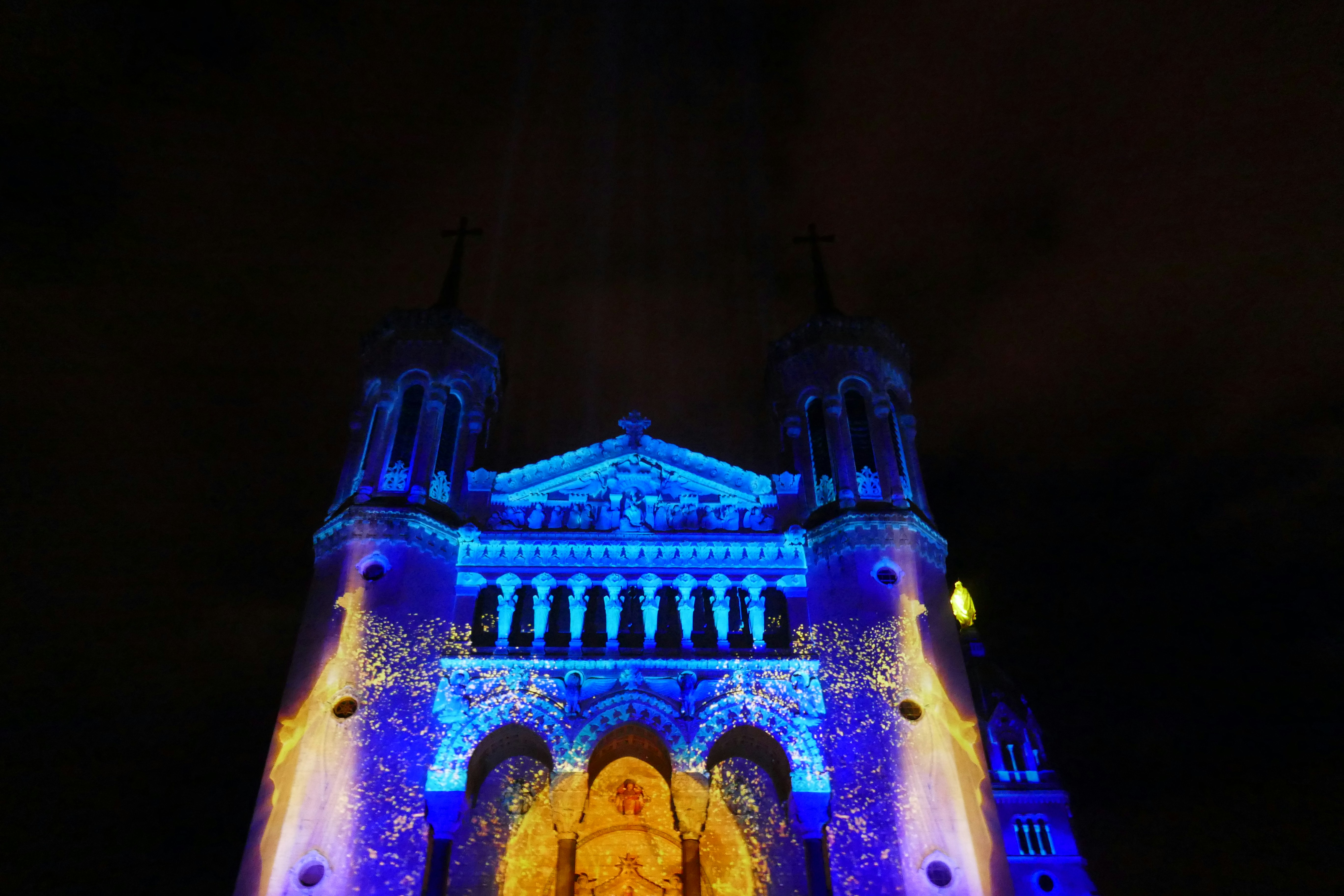 Blue Cathedral Under Night Skies: A Neon-Illuminated Facade