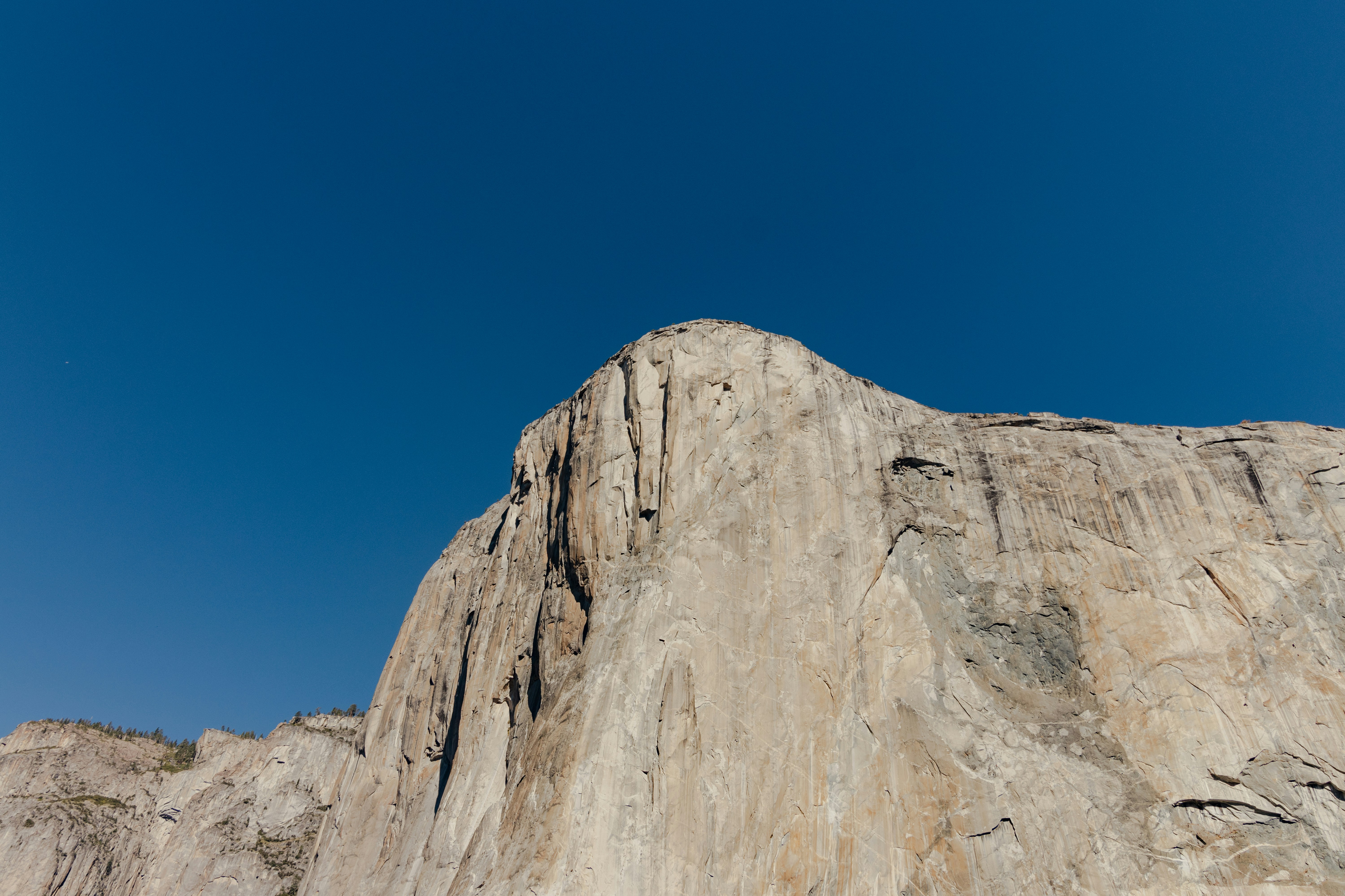 Towering Granite Monolith Under Azure Skies