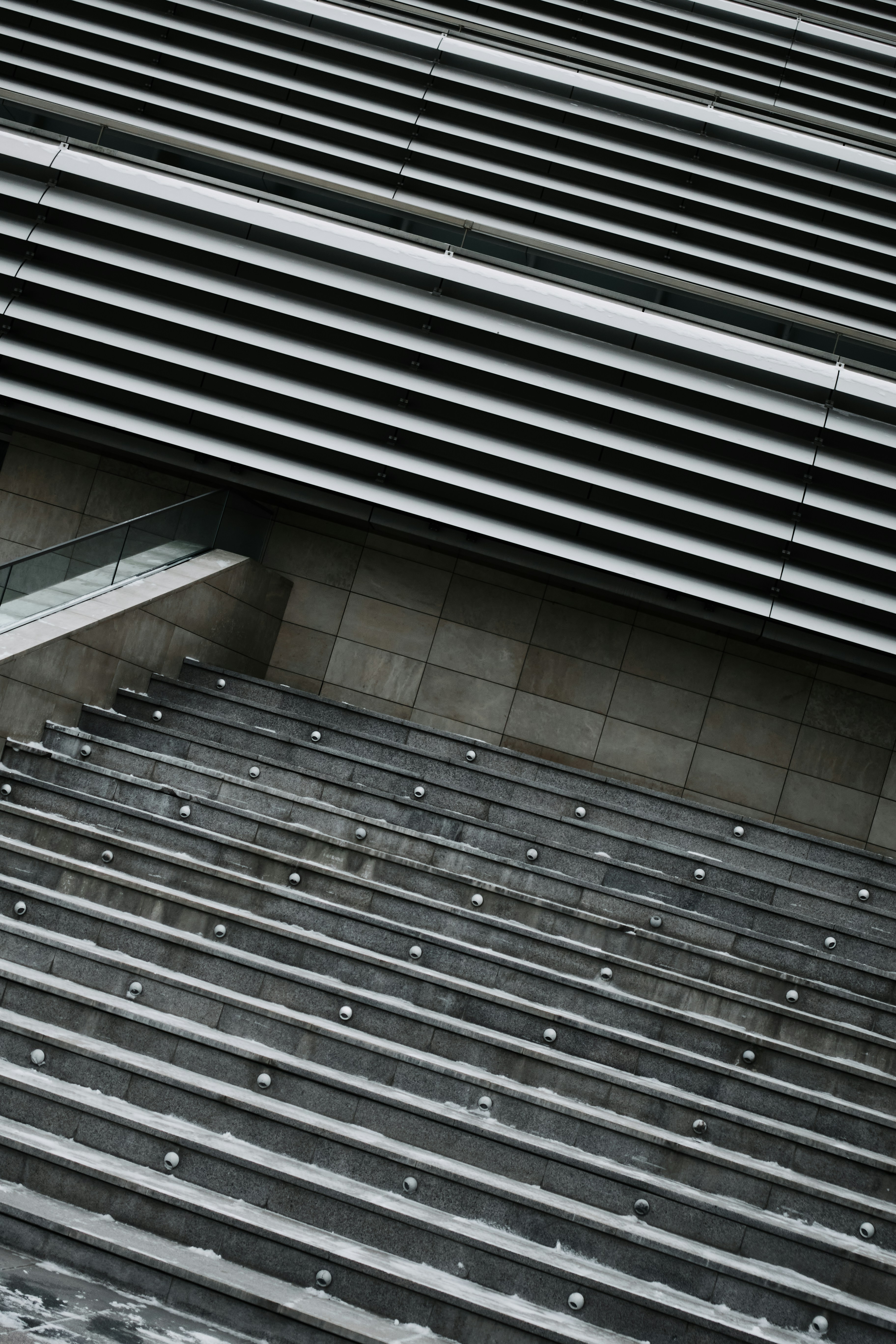A man riding a skateboard down a metal stair case photo – Free Banister ...