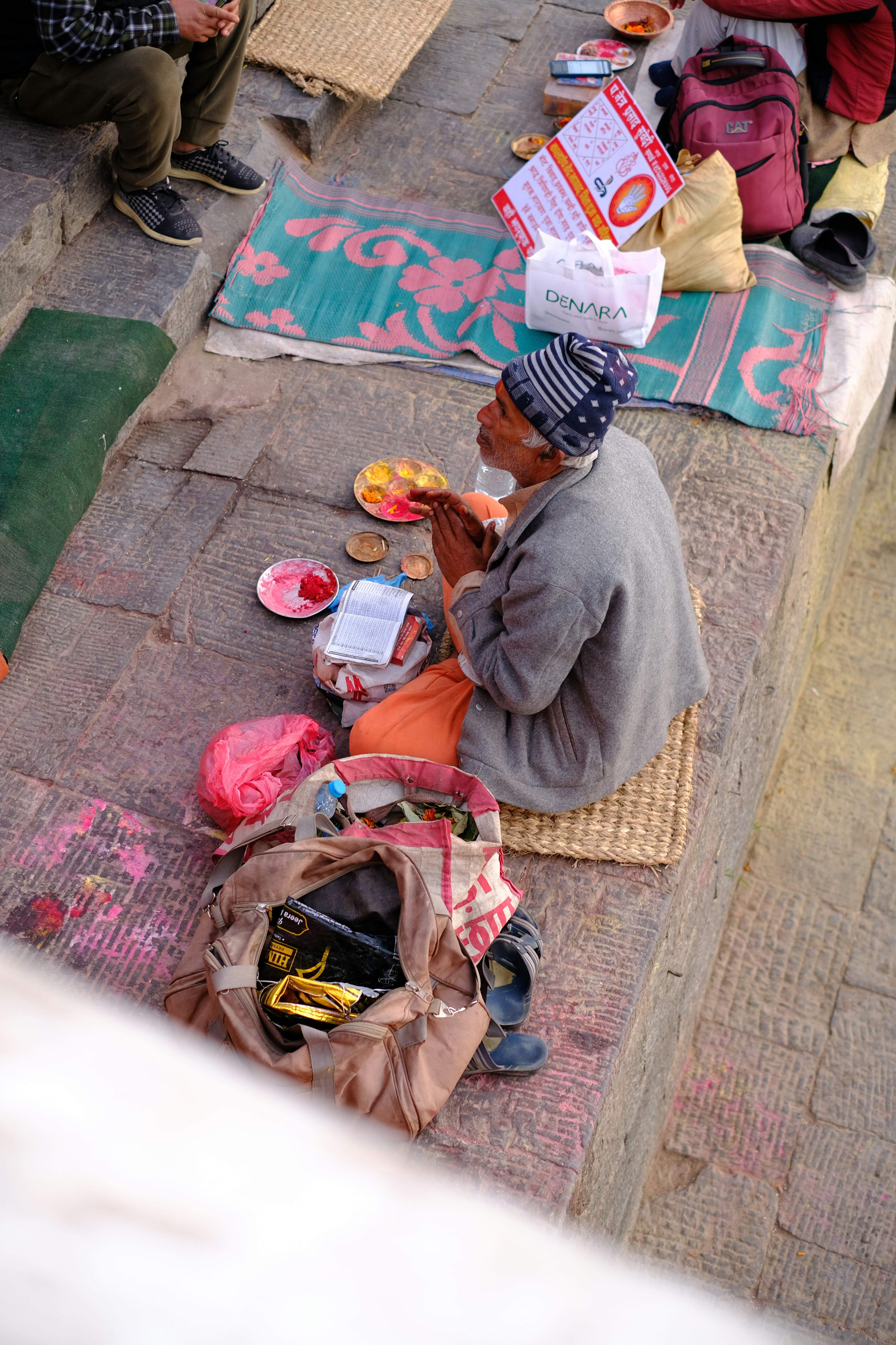 A group of people sitting on the ground eating food photo – Free Nepal ...