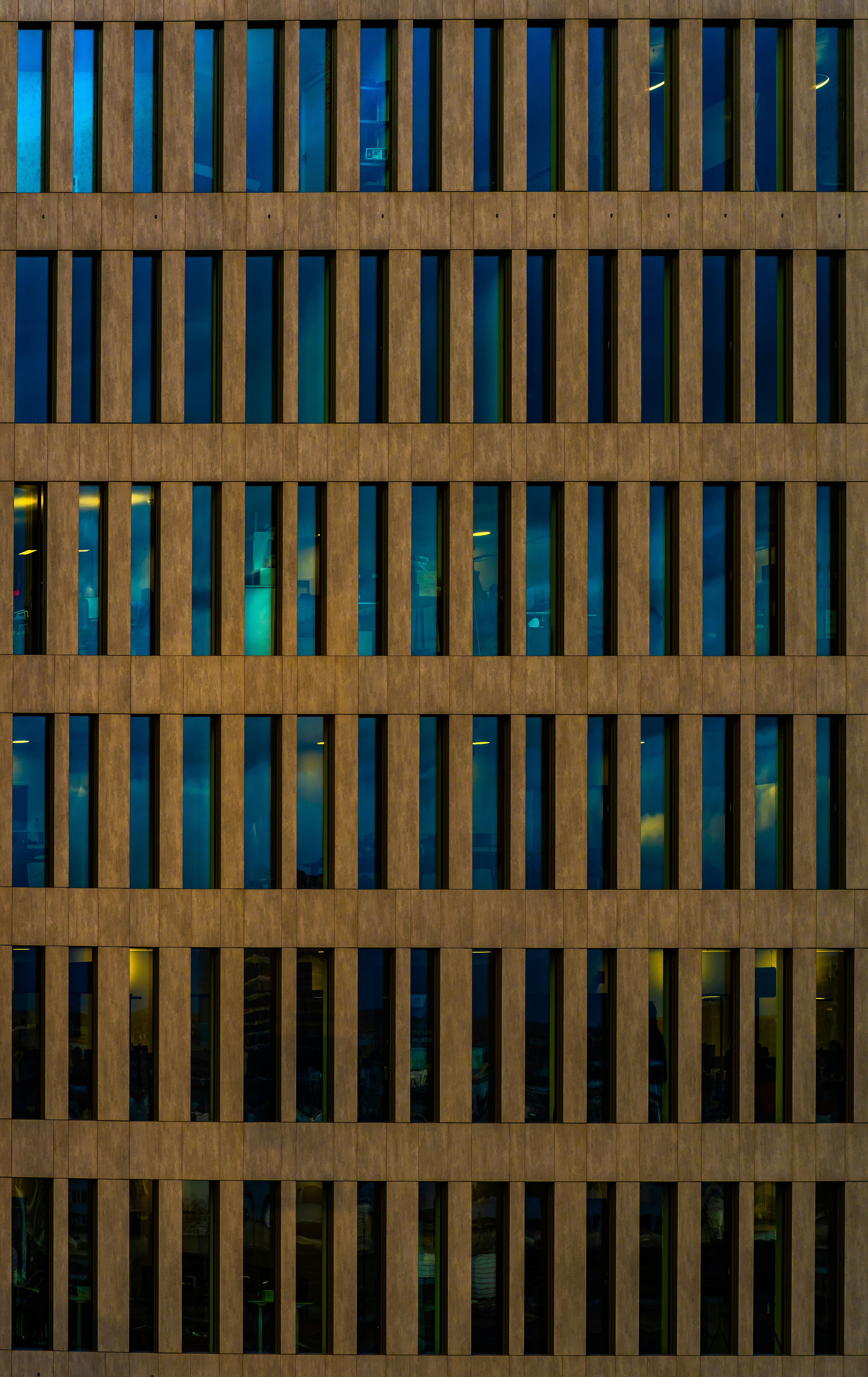 Rhythmic Indigo Reflections on a Brick Facade