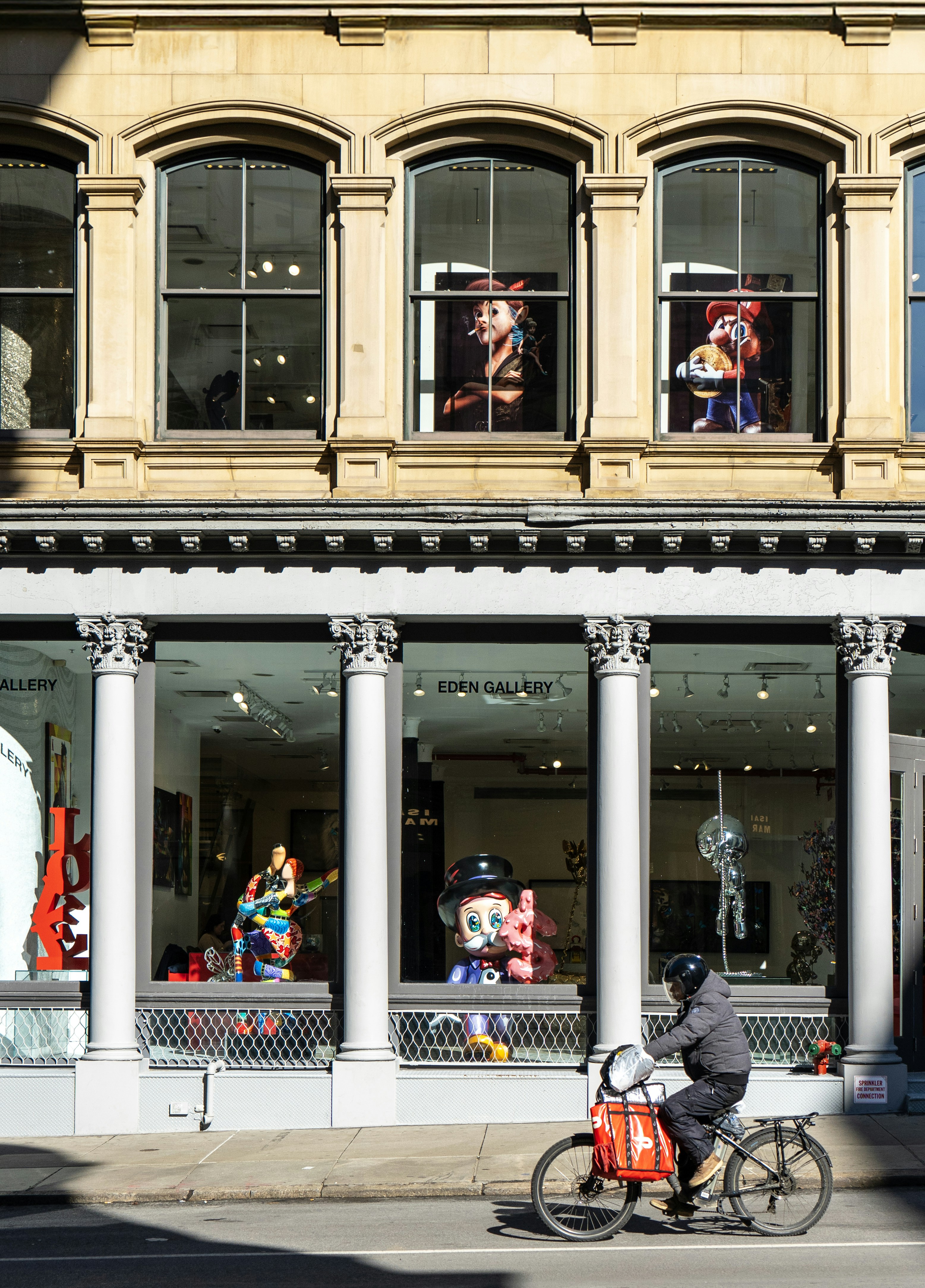 Pedestrian in Front of Gallery Windows: Colorful Street Scene with Cartoon Figures