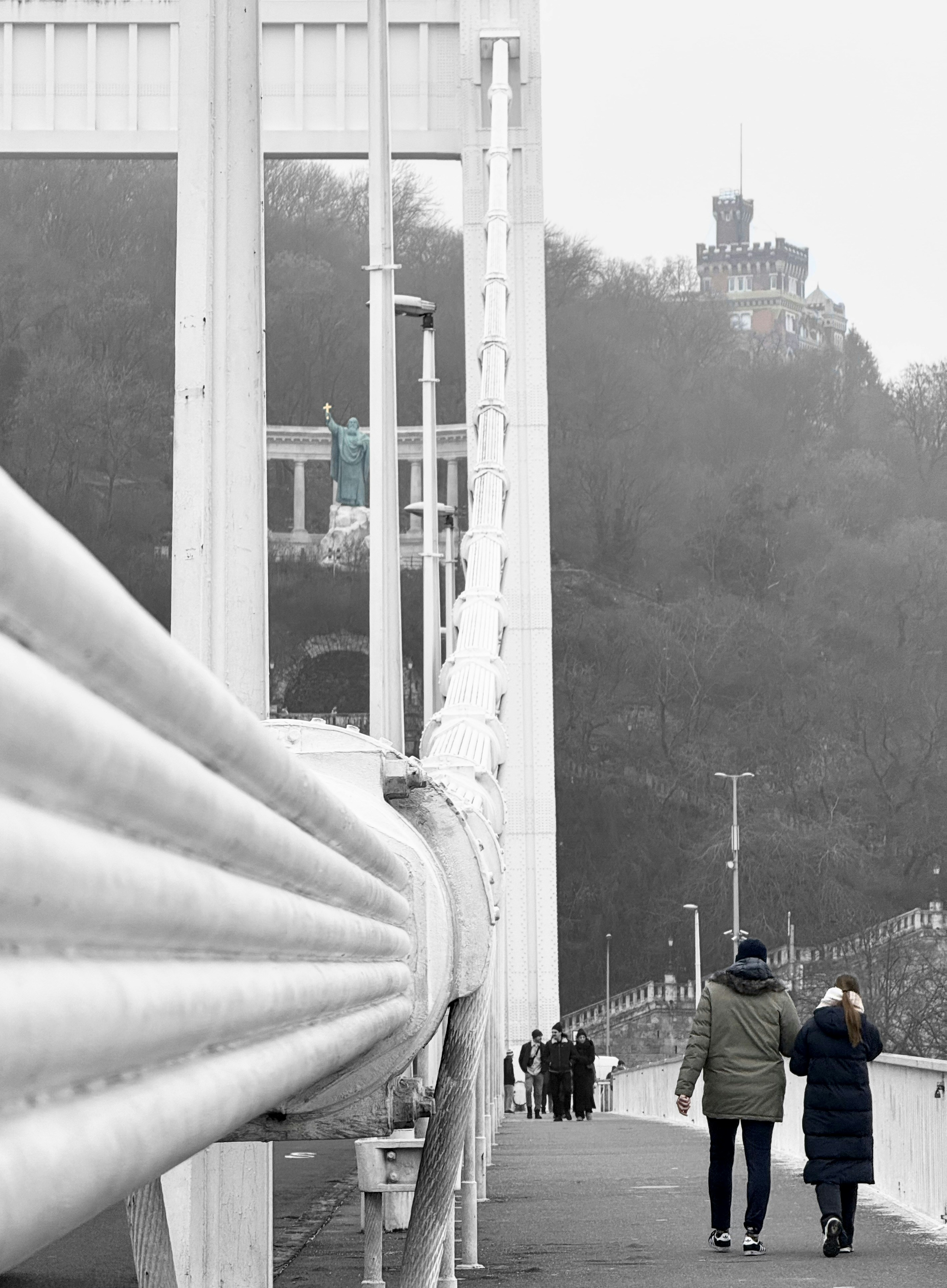 A man and a woman walking down a bridge photo – Free Budapest Image on ...