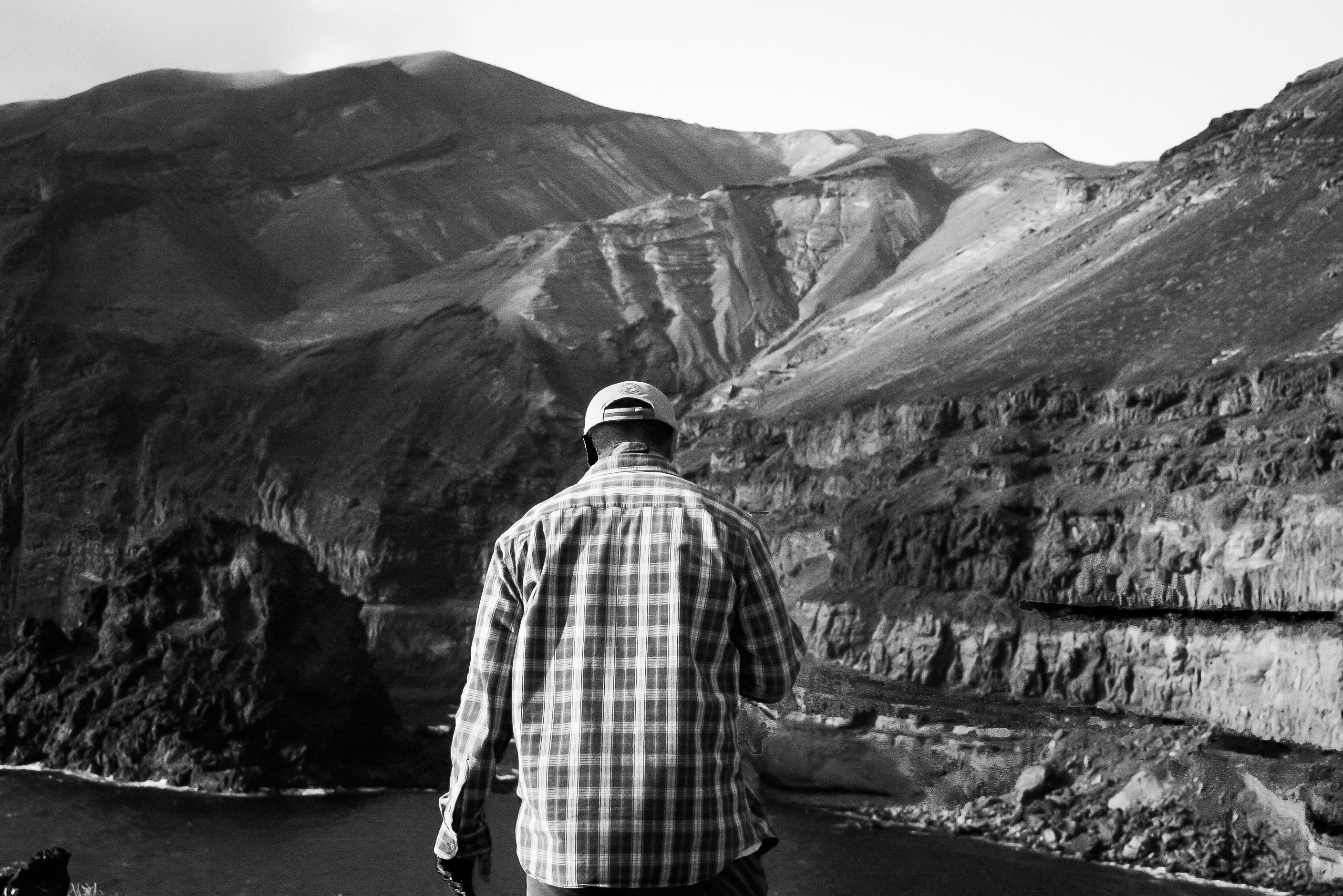 Contemplation Amidst Rugged Peaks