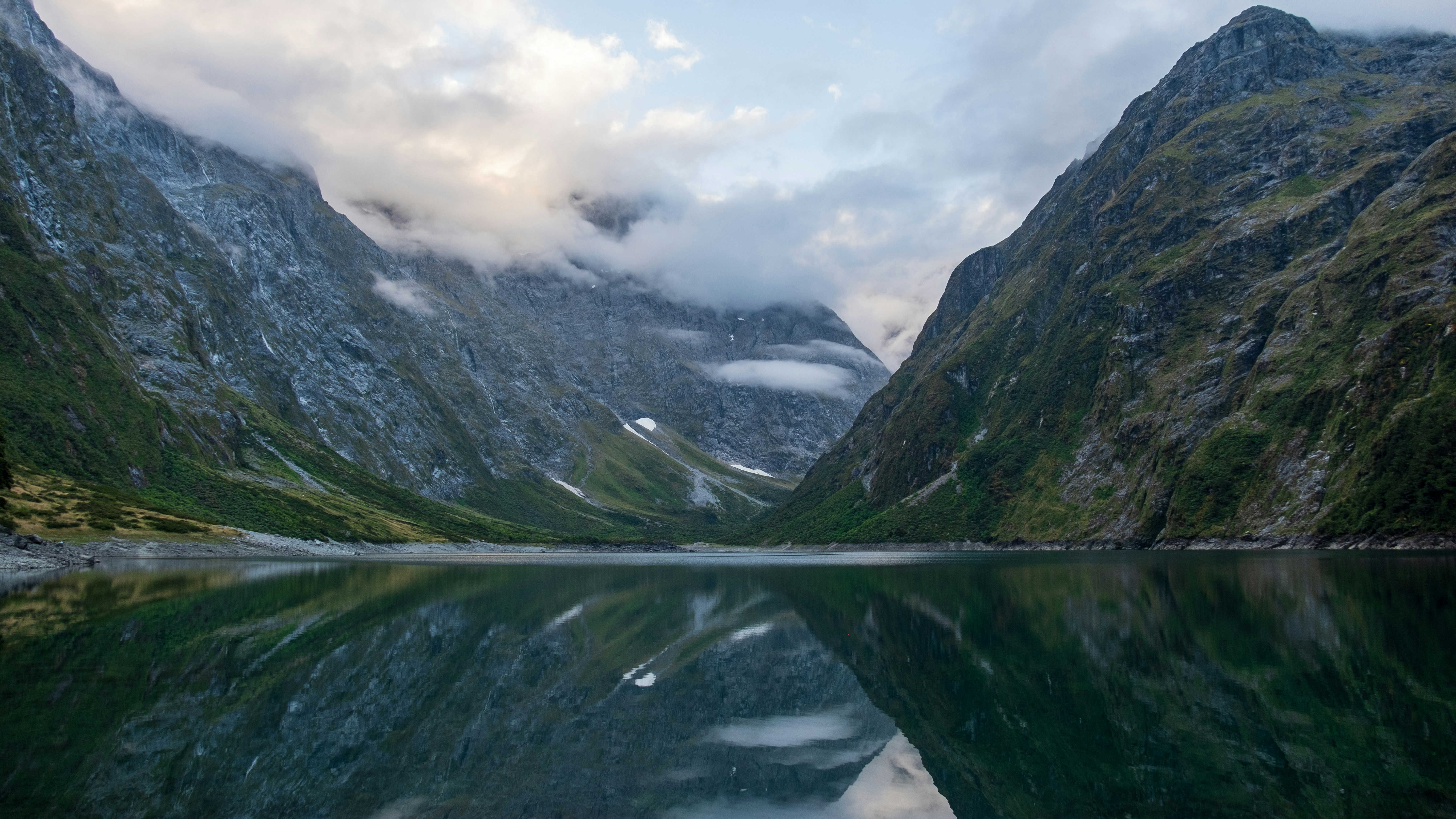 Tranquil Reflections of Fjordland PeaksDennis Thompson