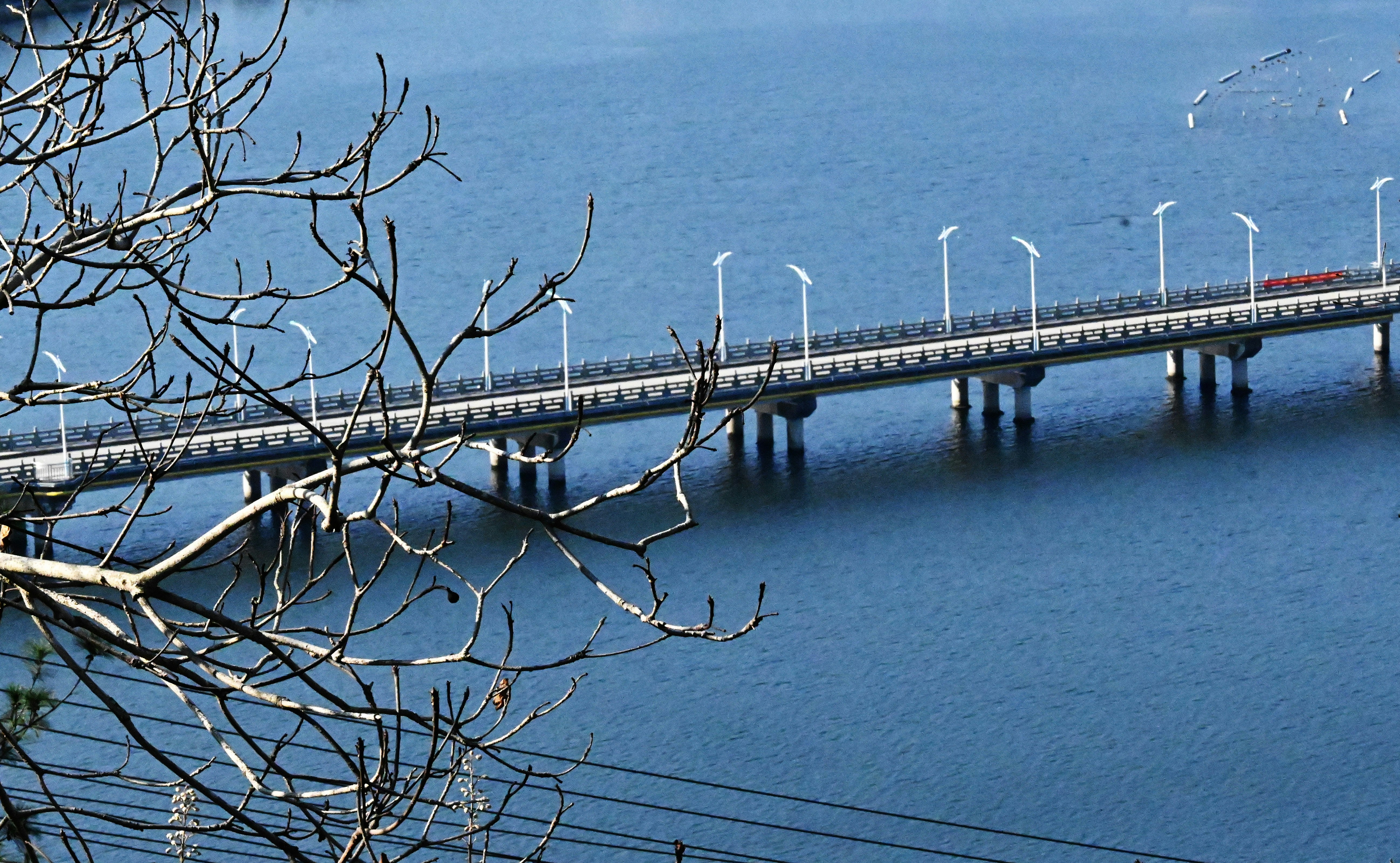A long bridge over a large body of water photo – Free Bridge Image on ...
