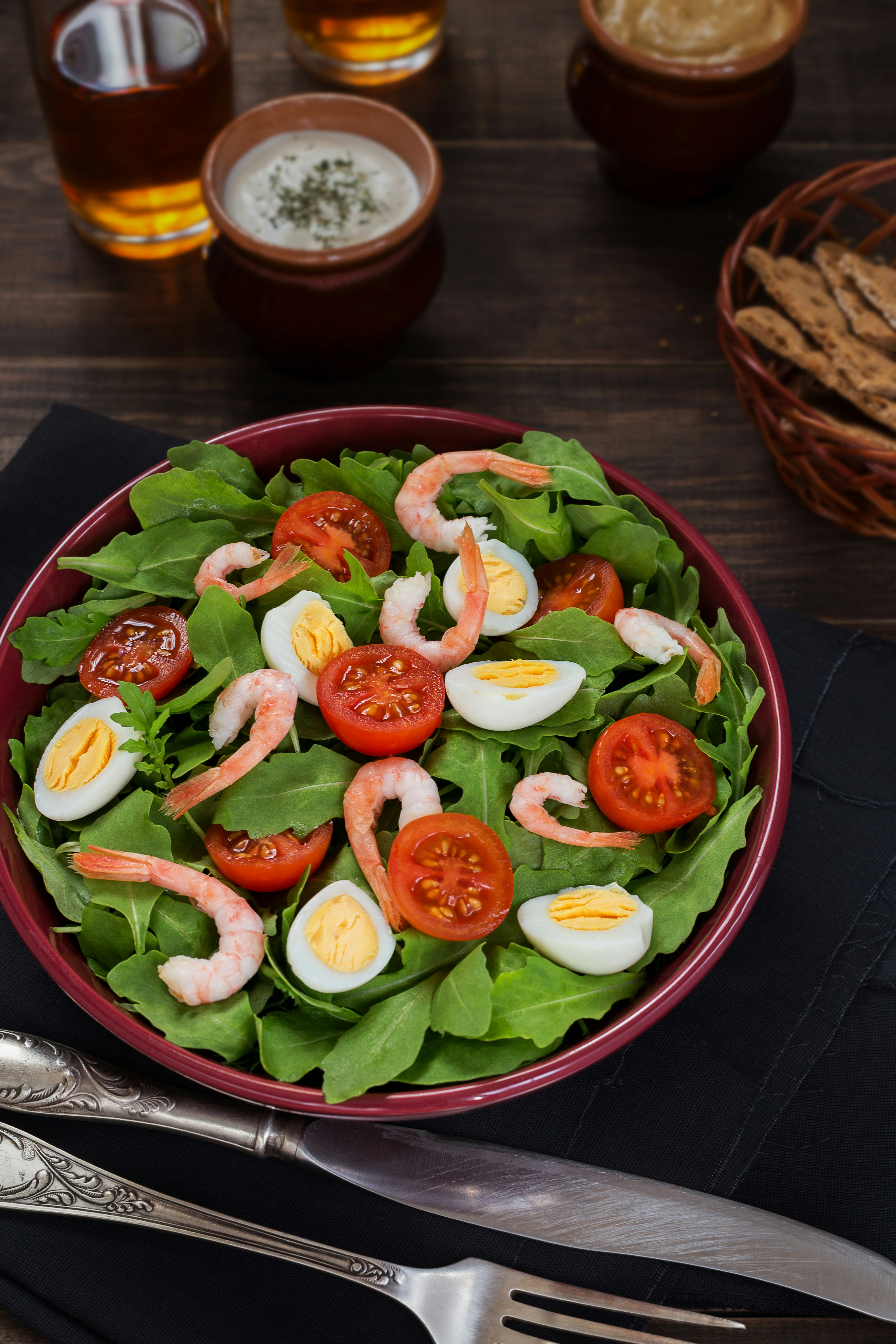 Crimson Bowl Garden: Shrimp, Eggs, and Tomatoes on Fresh Arugula