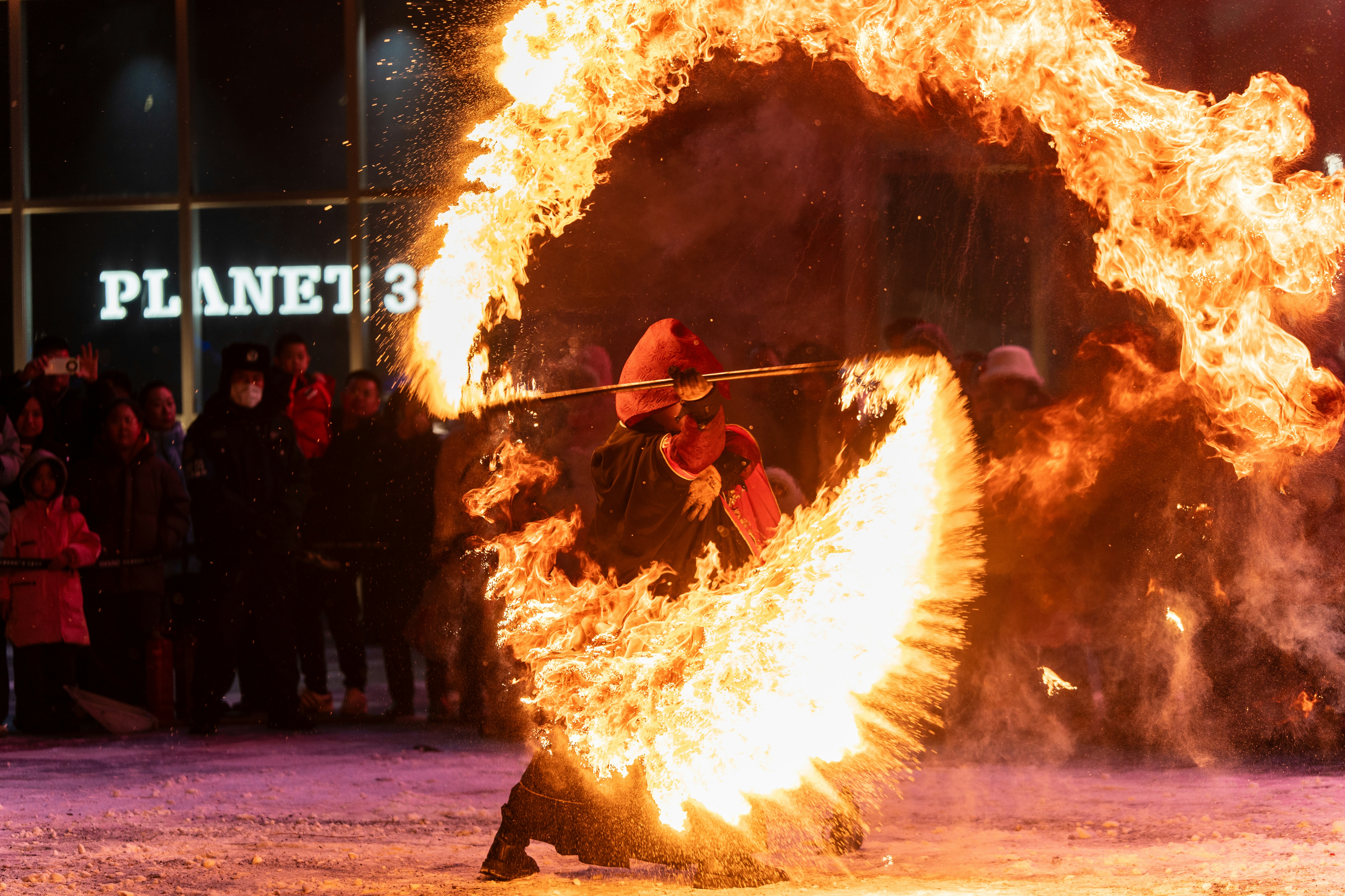 Circle of Fire: A Lone Performer Distills Focus in a Snowlit Night