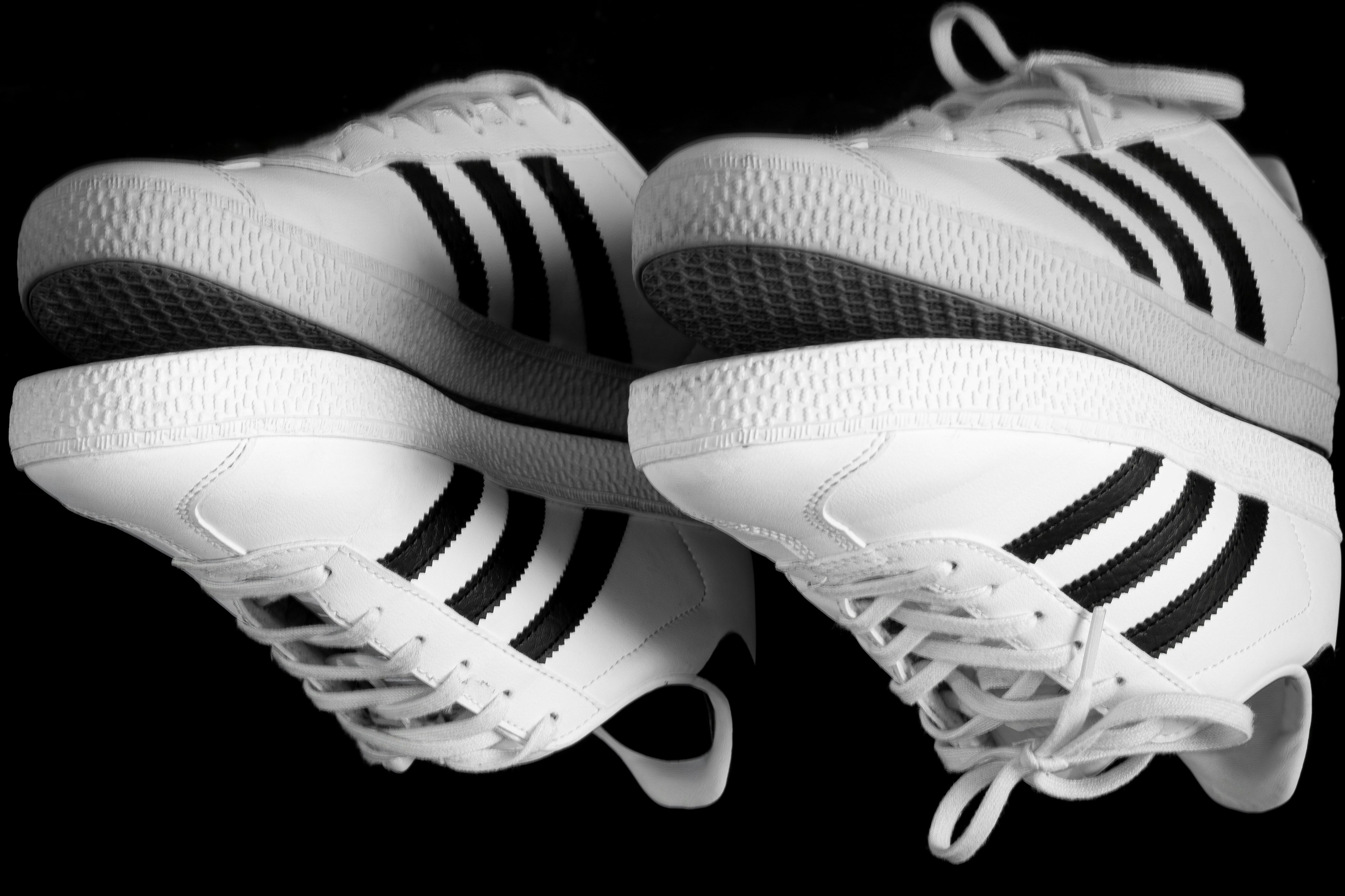A pair of white shoes with black stripes photo – Free Kickers Image on ...