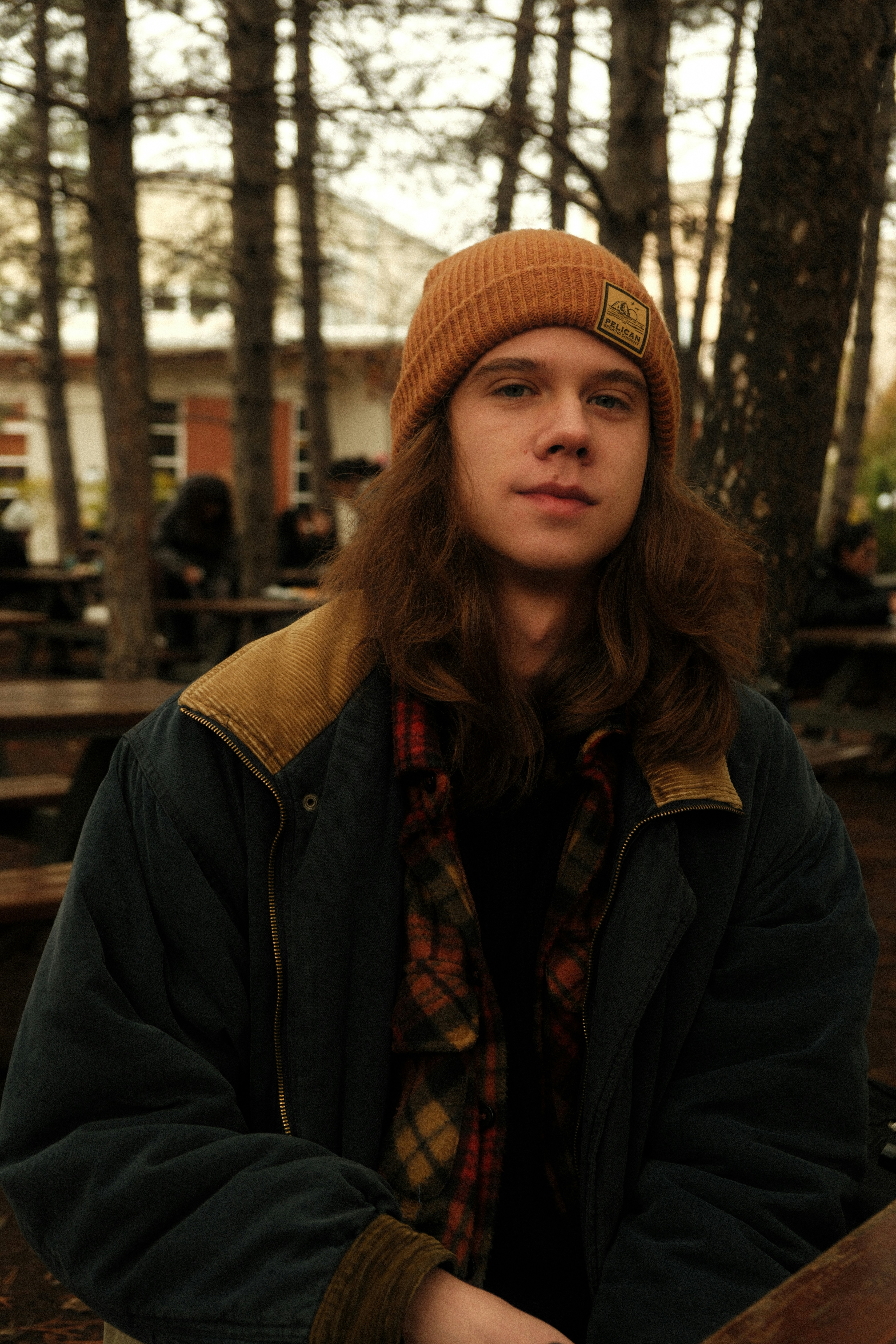 Pineside Quiet: Portrait in Cinnamon Light at a Casual Outdoor Café