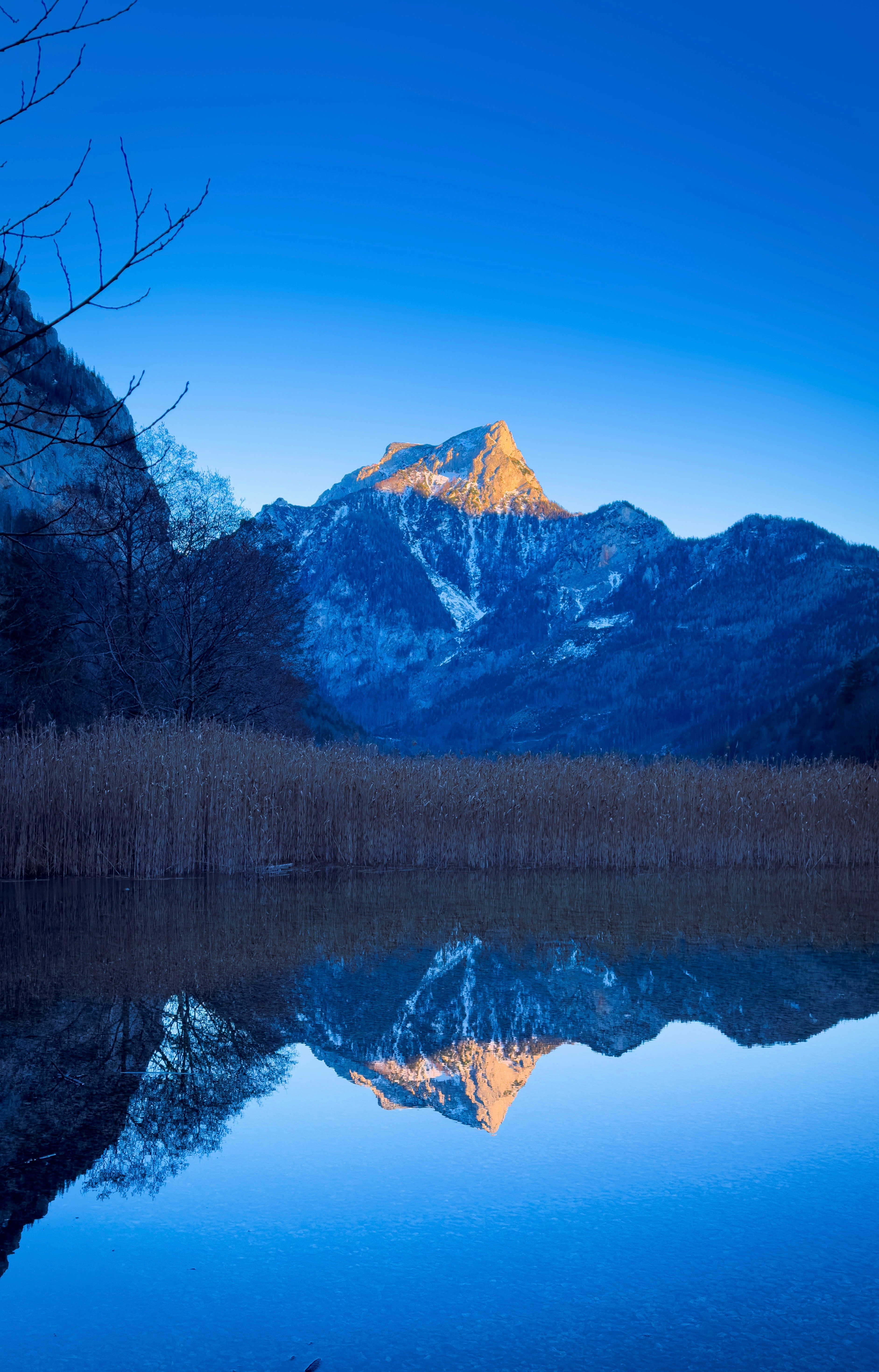 Sunlit Peak Above a Moonlit Lake