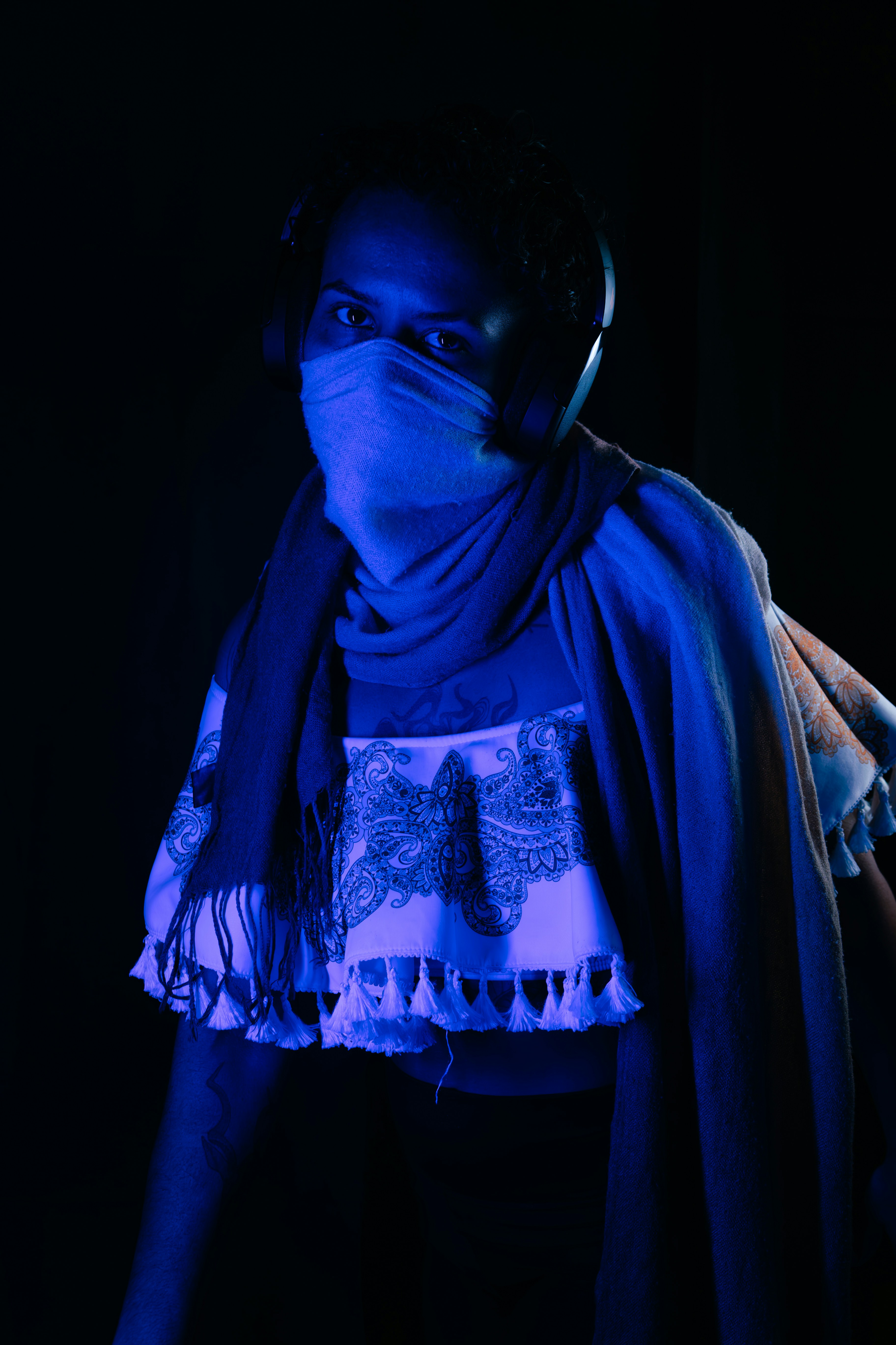 A woman with a blue light on her face photo – Free Portrait Image on ...