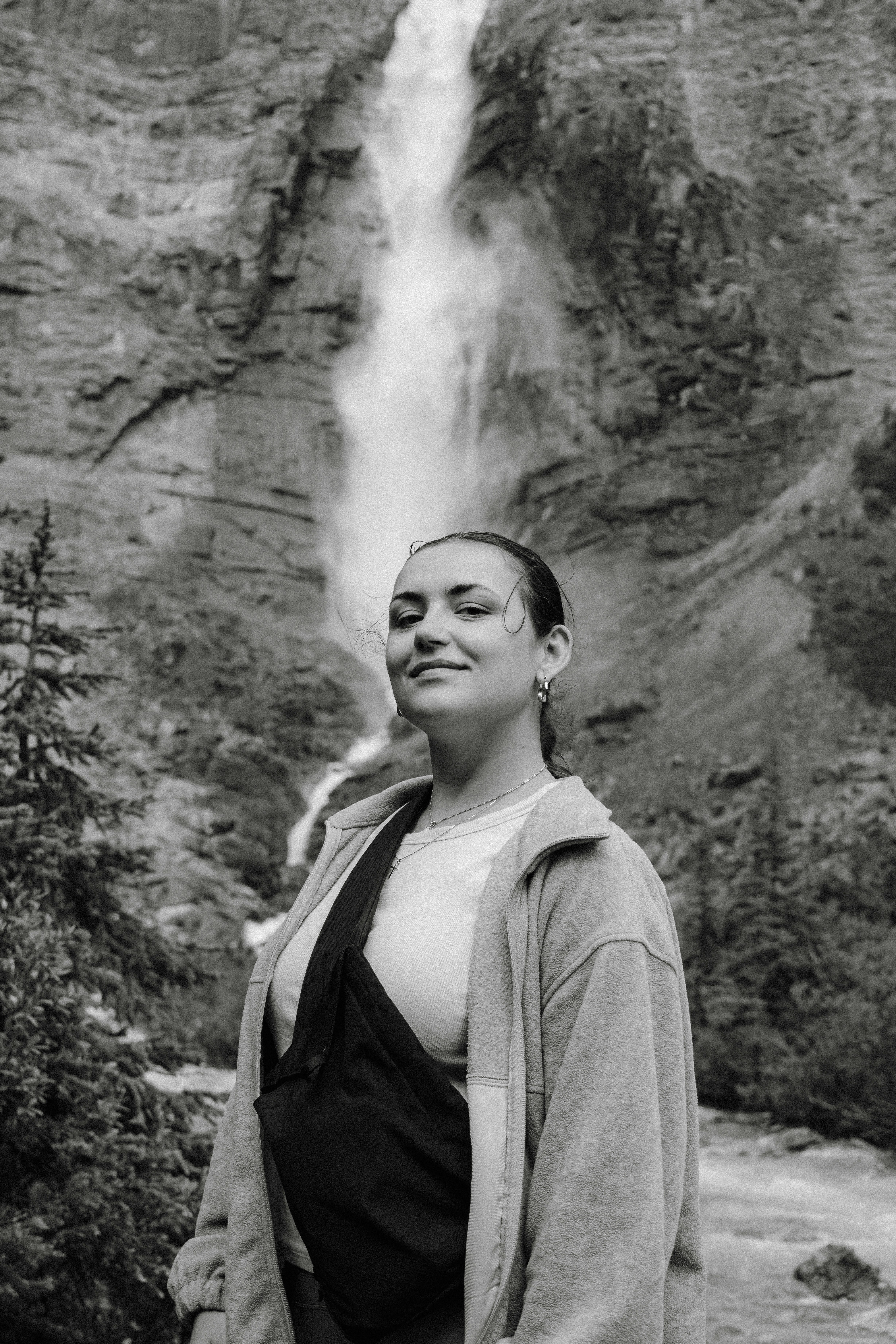 A Quiet Portrait Beneath a Cascade