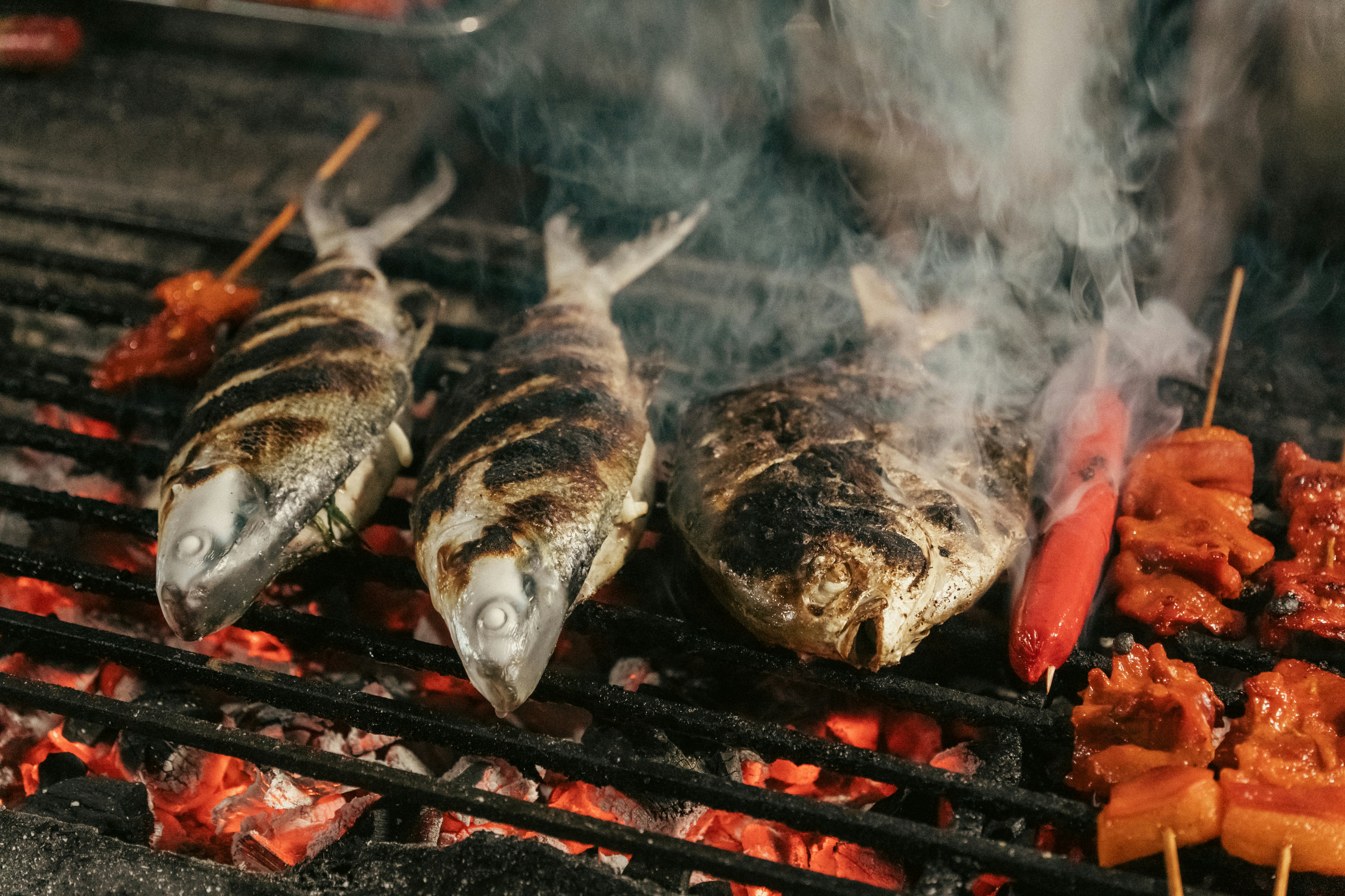 A bunch of fish are cooking on a grill photo – Free Food Image on Unsplash