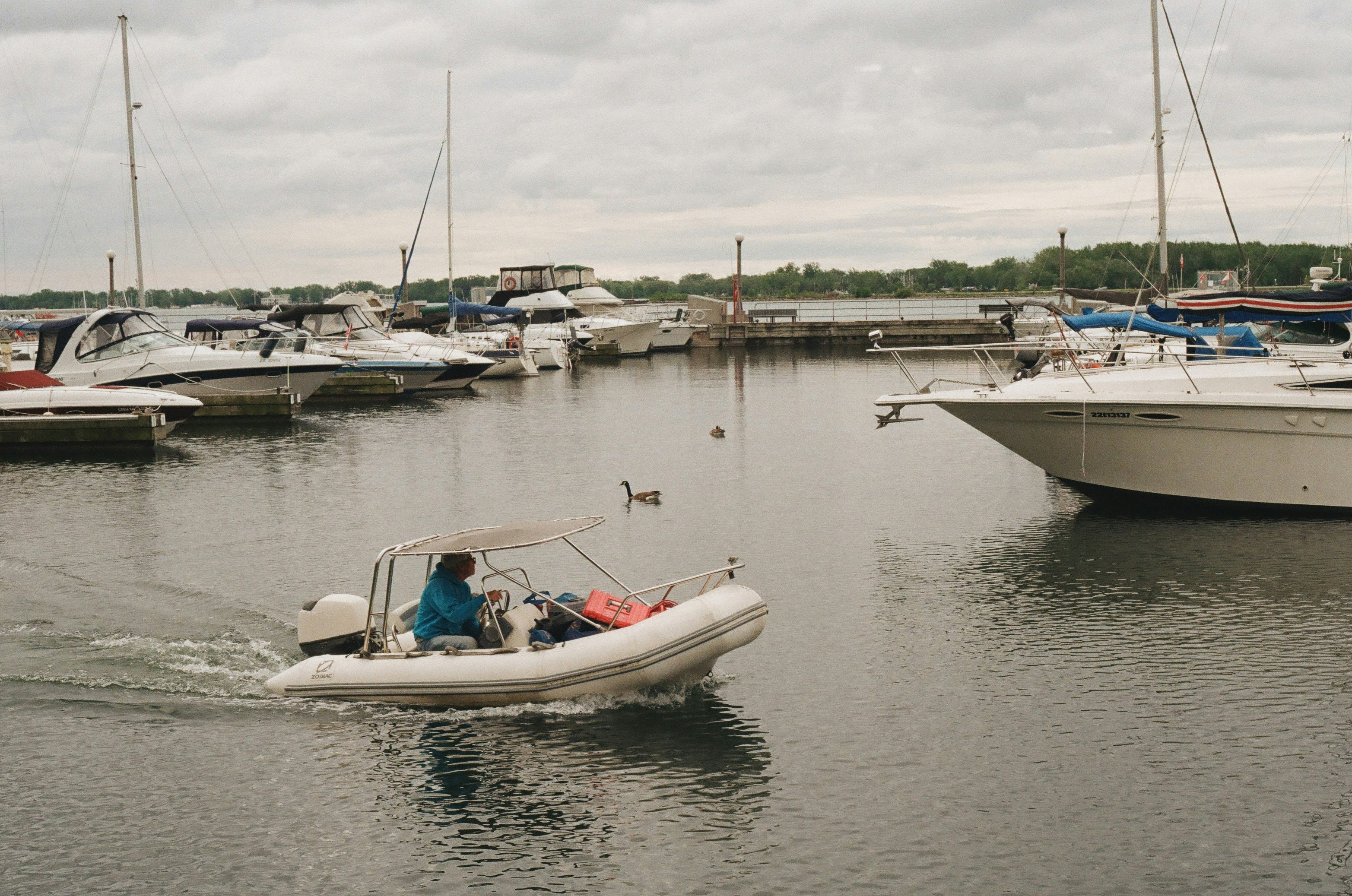 Toward the Quiet Inlet: A Small Boat Puts Around a Marina