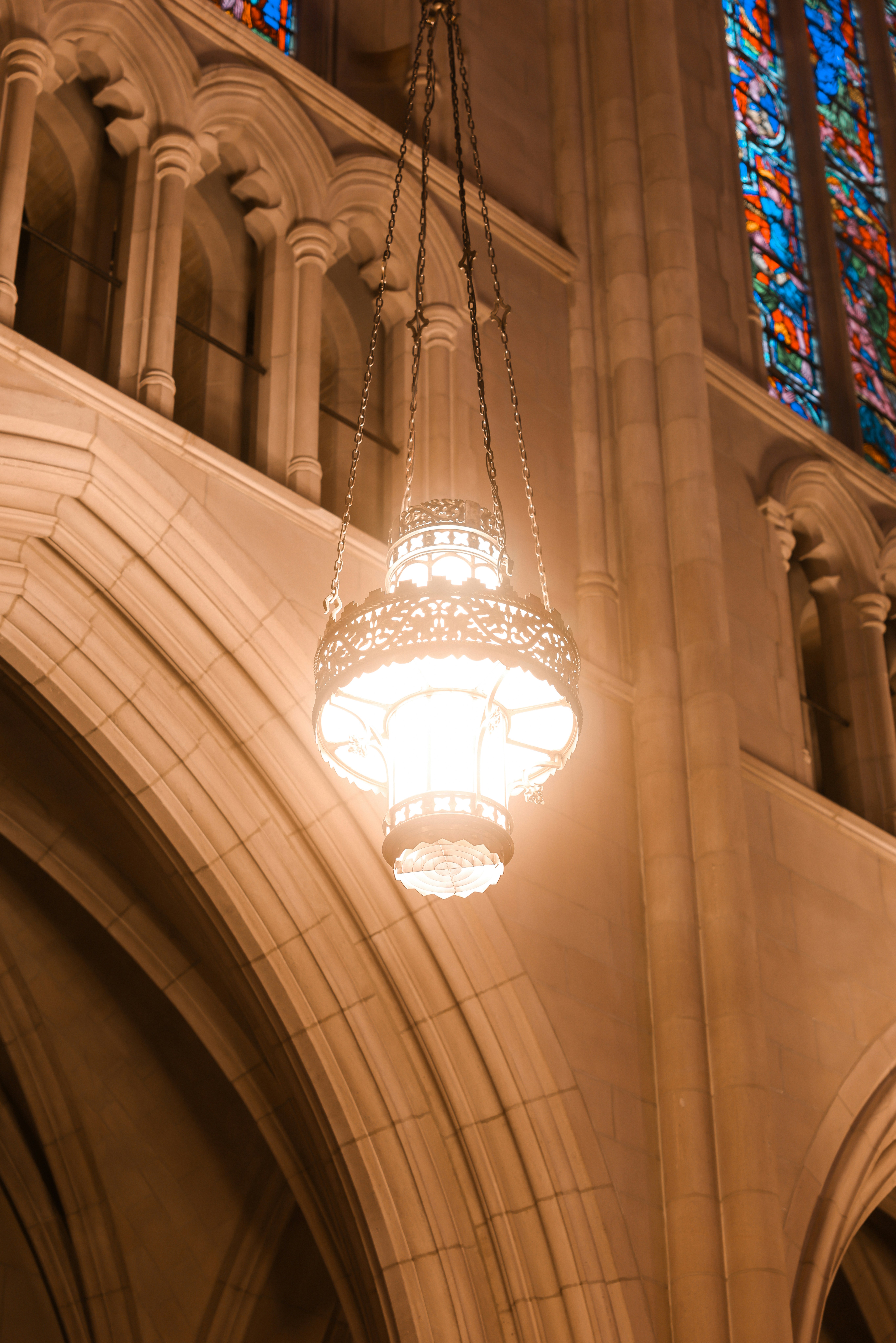 Lantern in the Nave: a Warm Halo Between Gothic Arches