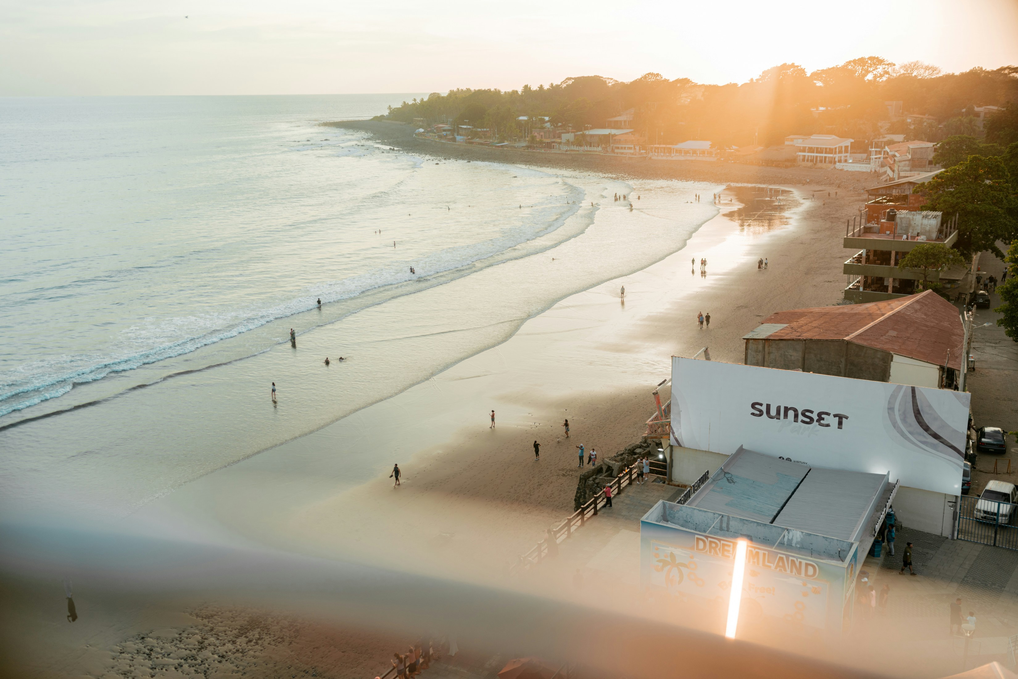 A view of a beach from a window photo – Free Ocean Image on Unsplash
